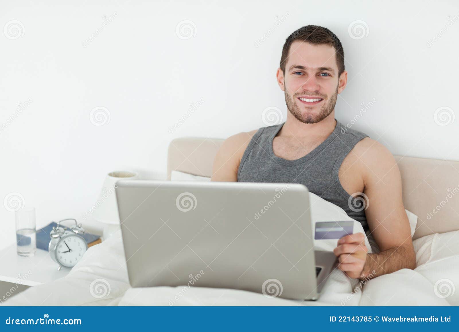 Young man shopping online stock image. Image of positive - 22143785