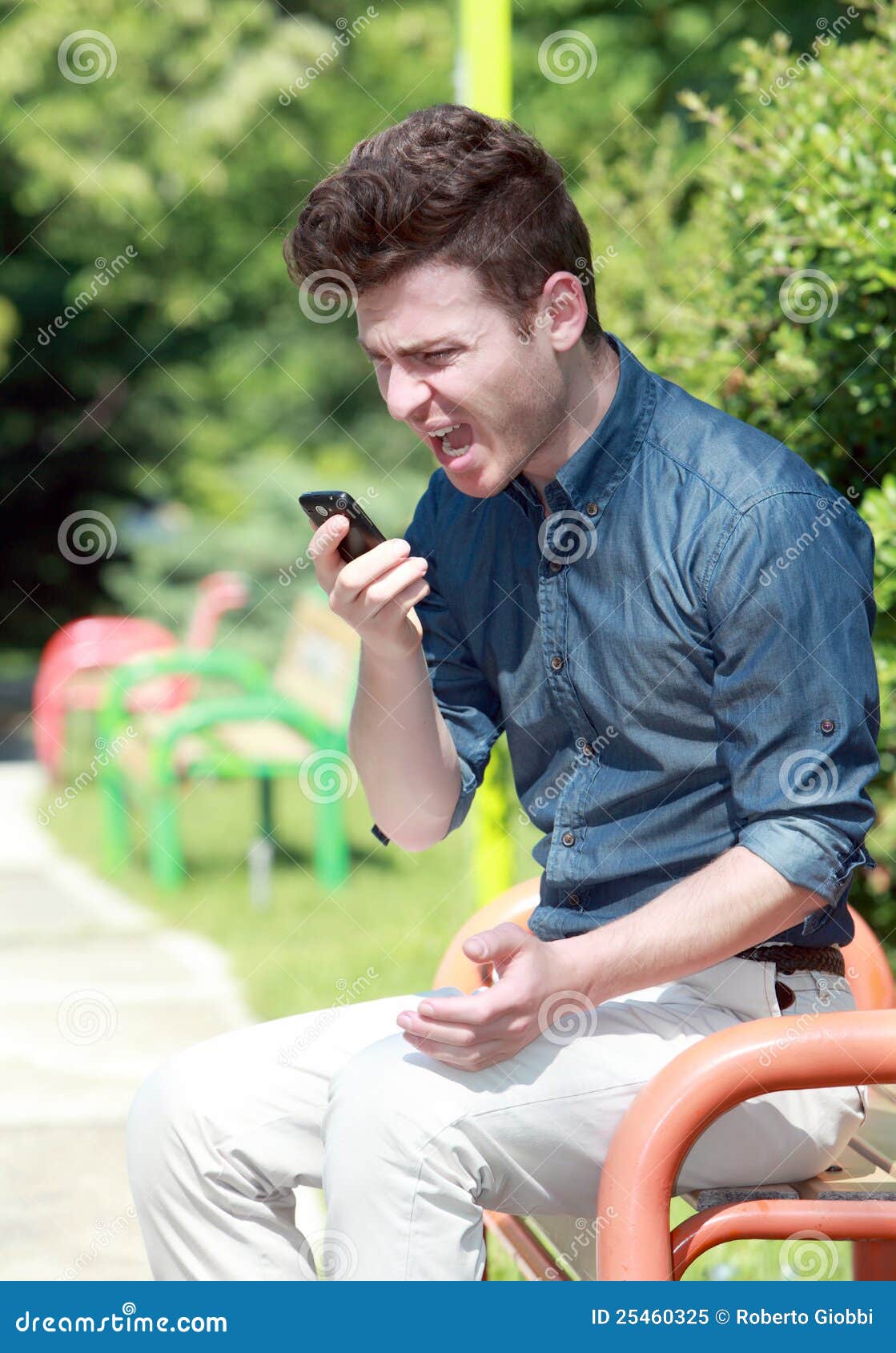 Young Man Shouting on Telephone Stock Image - Image of shouting, casual ...