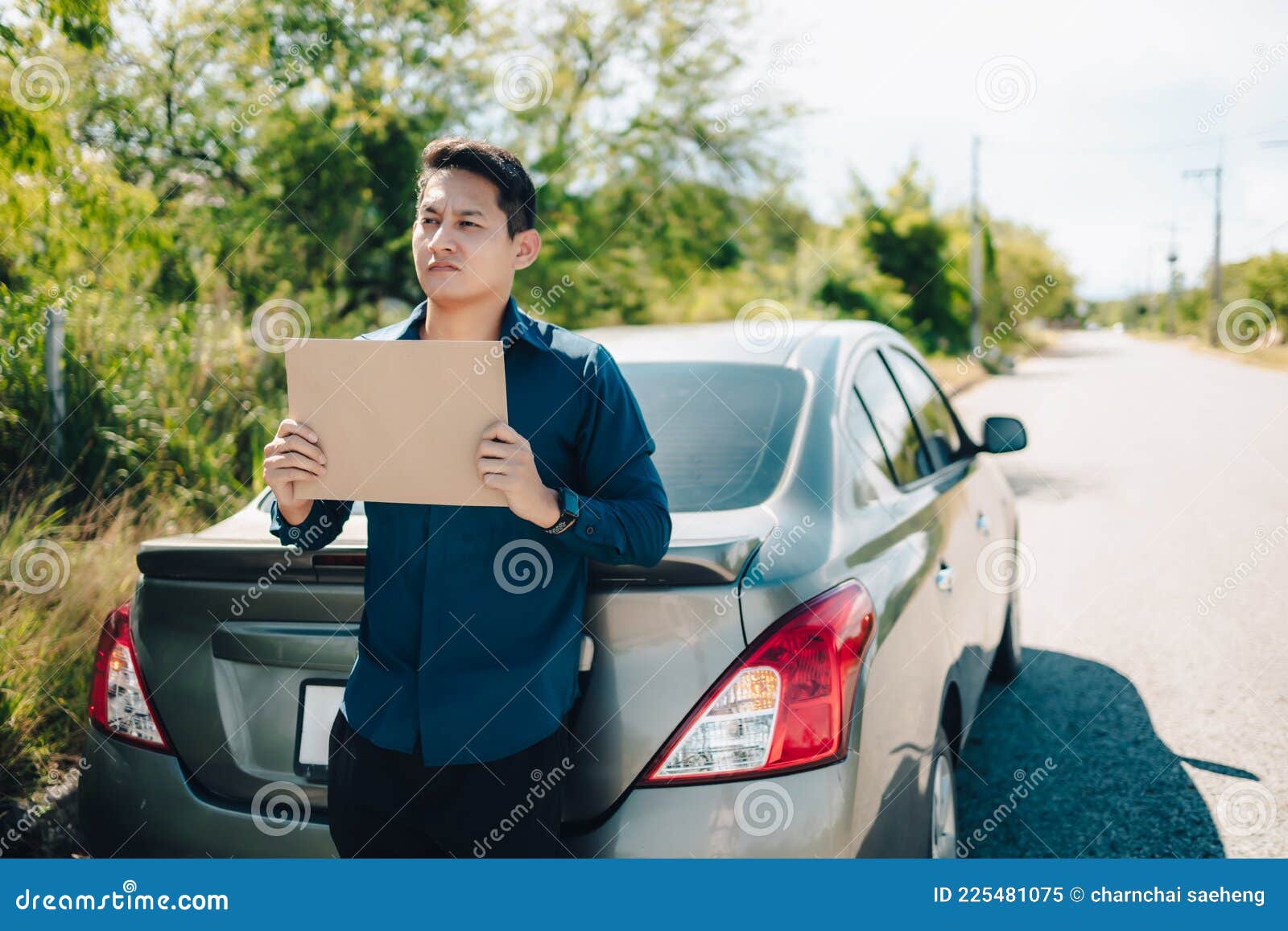 Young Man Show Paper on Roadside for Assistance after Broken Car. Car ...