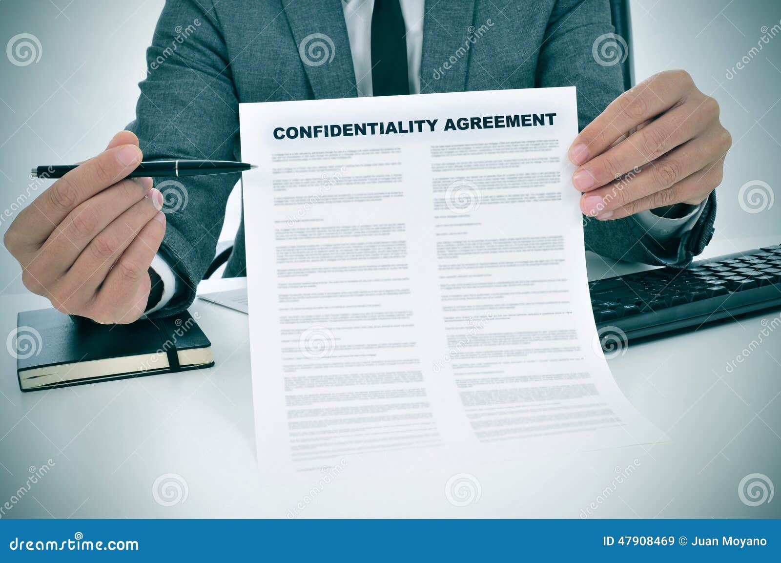 Young Man Showing a Confidentiality Agreement Document Stock Image ...