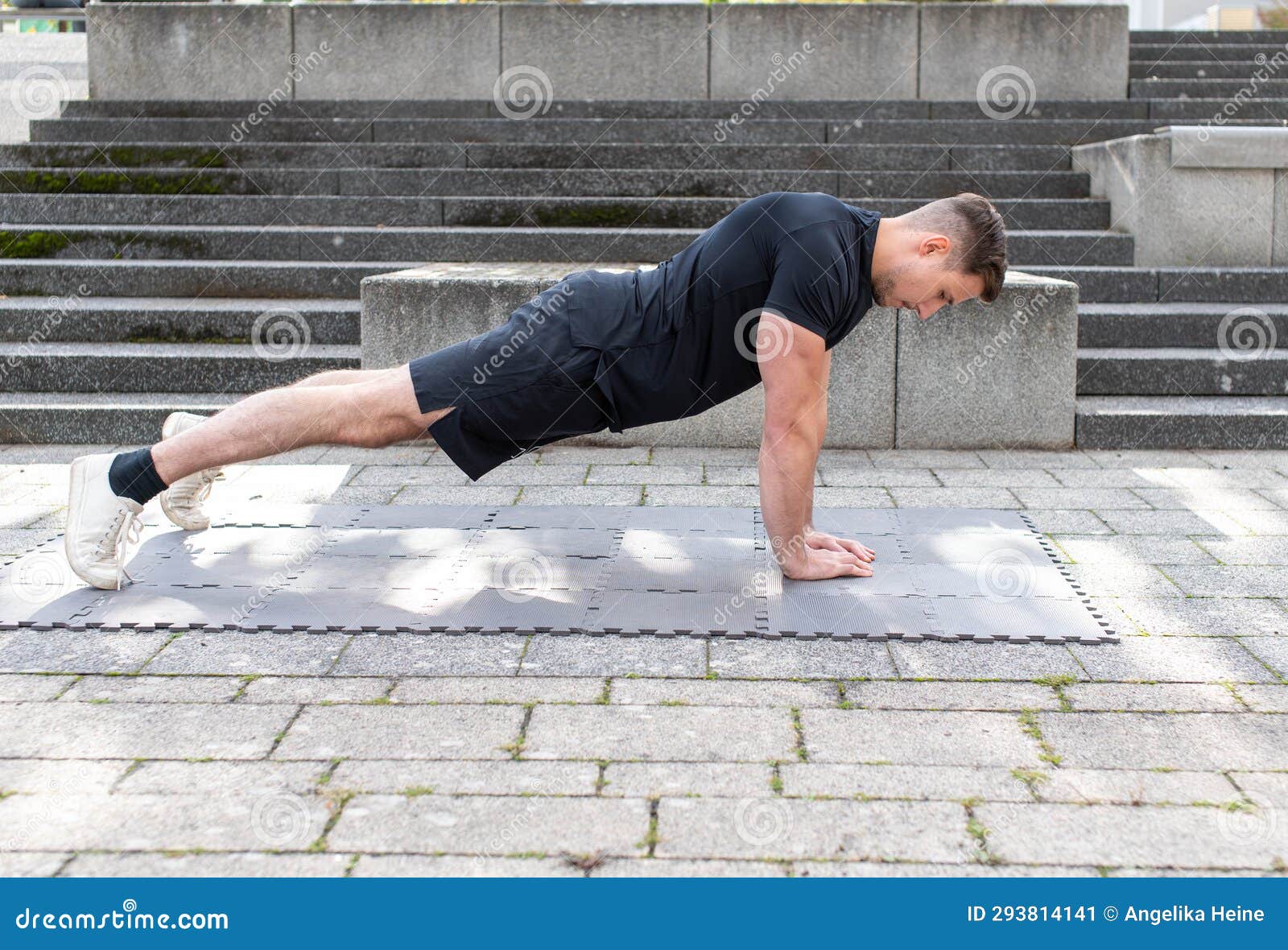 Young Man Doing a Triangle Push-up or Diamond Push-up Outdoors on an ...
