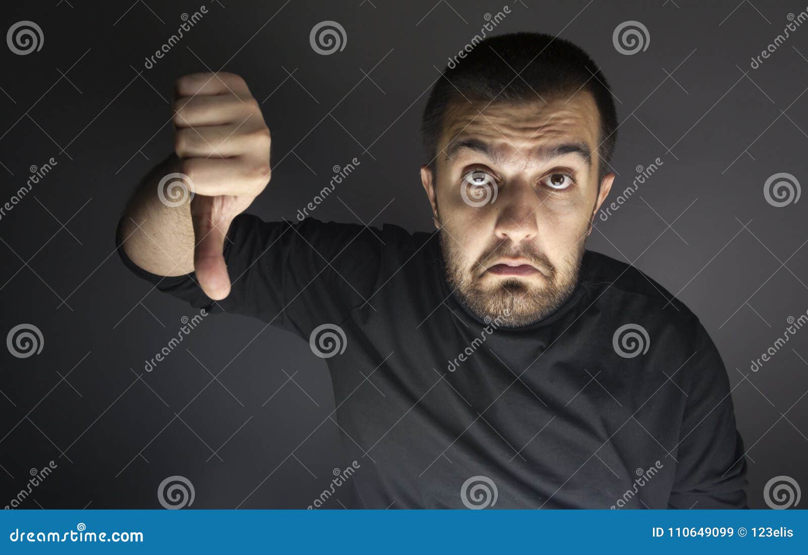 Young man thumbs down stock image. Image of people, thumb - 110649099