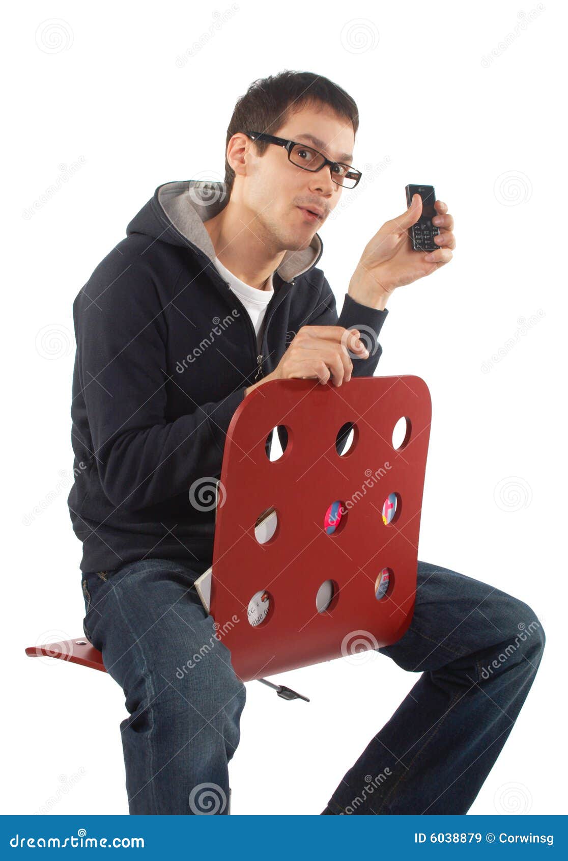 Young Man Shows Cellphone Sitting on Stool Stock Image - Image of ...