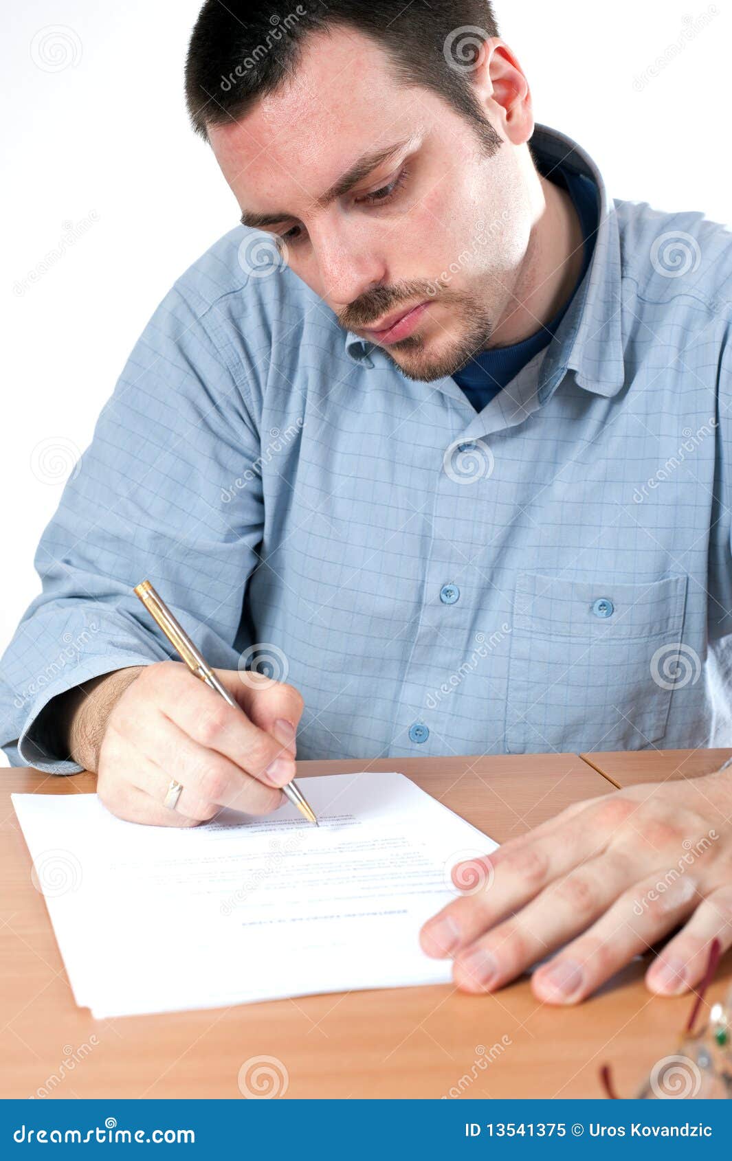 Young Man Signing Contracts Stock Image - Image of paper, books: 13541375
