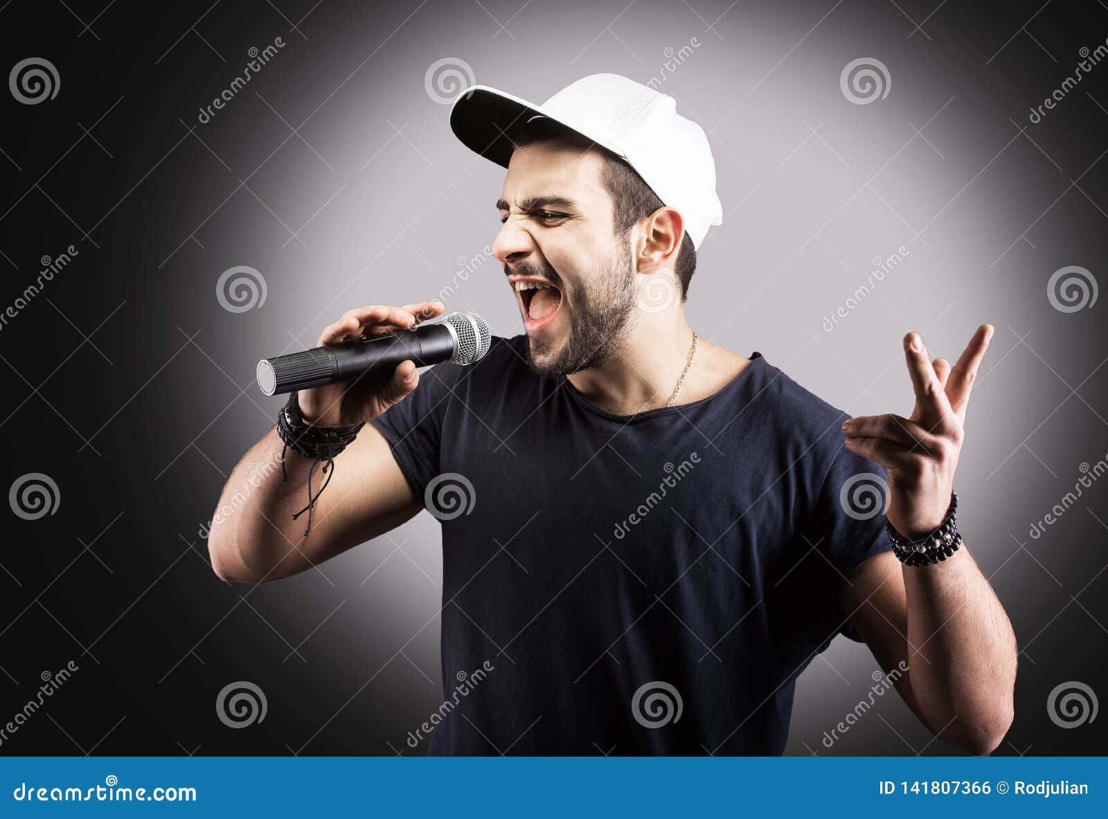 Young Man Singing into a Microphone Stock Photo - Image of eyes, music ...