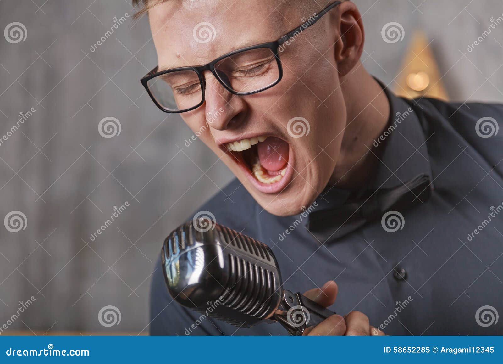 Young Man Singing with Microphone Stock Image - Image of adult, passion ...
