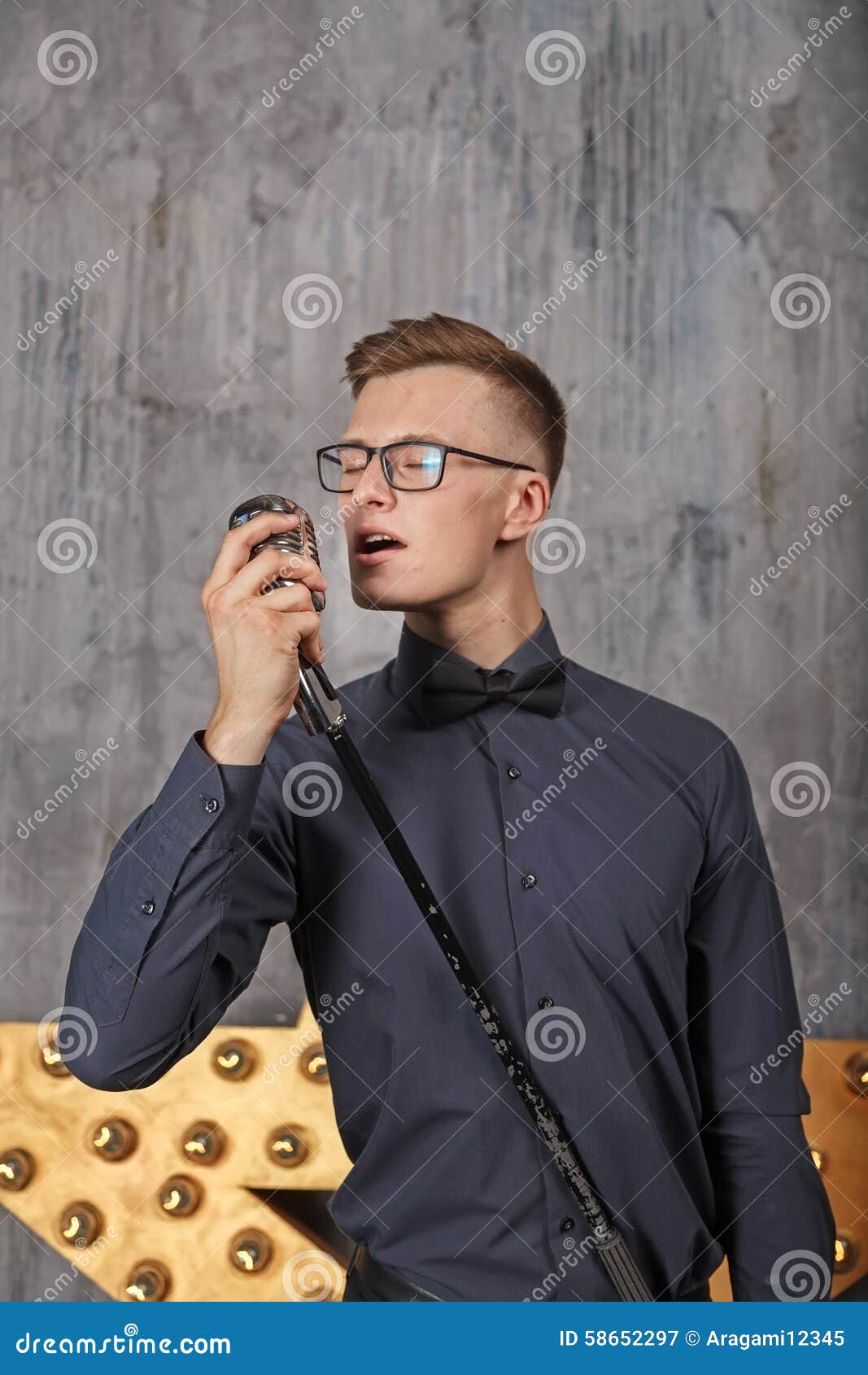 Young Man Singing with Microphone Stock Image - Image of alone, glamour ...