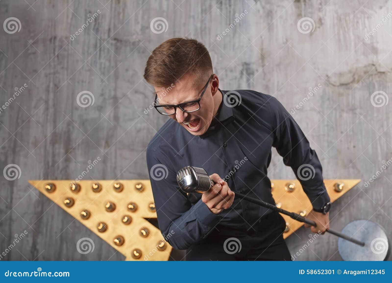 Young Man Singing with Microphone Stock Image - Image of concert ...
