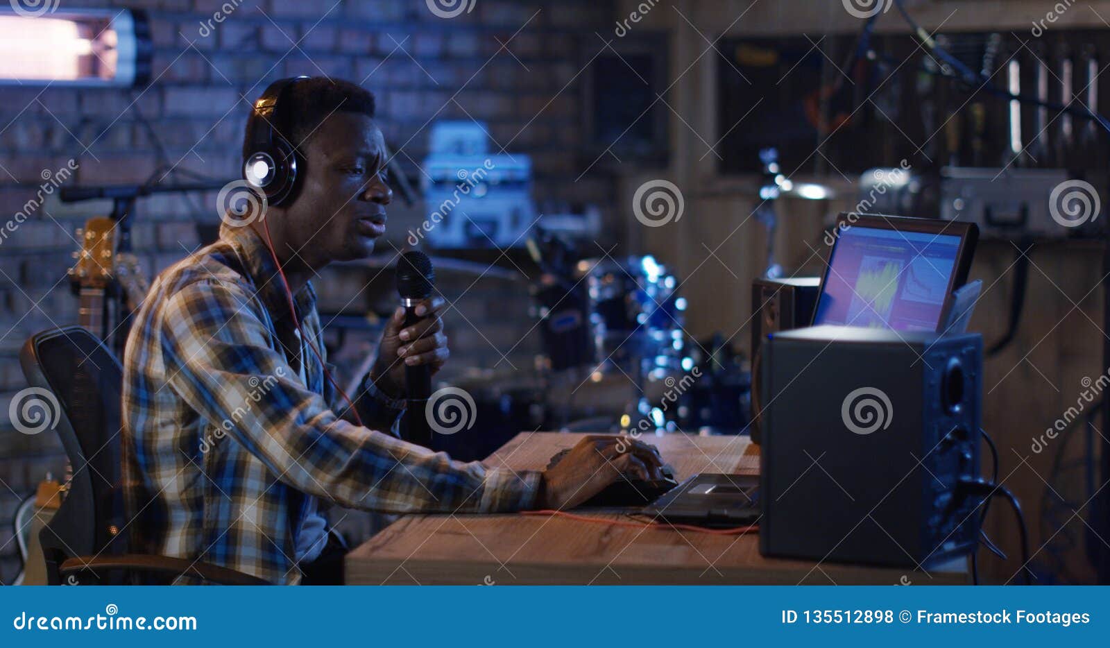 Young Man Singing in Studio Stock Photo - Image of playing, editing ...