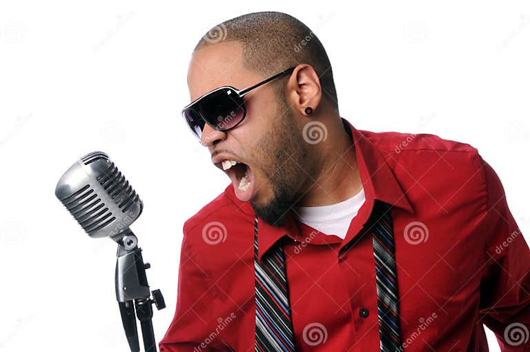 Young Man Singing into Vintage Microphone Stock Image - Image of young ...