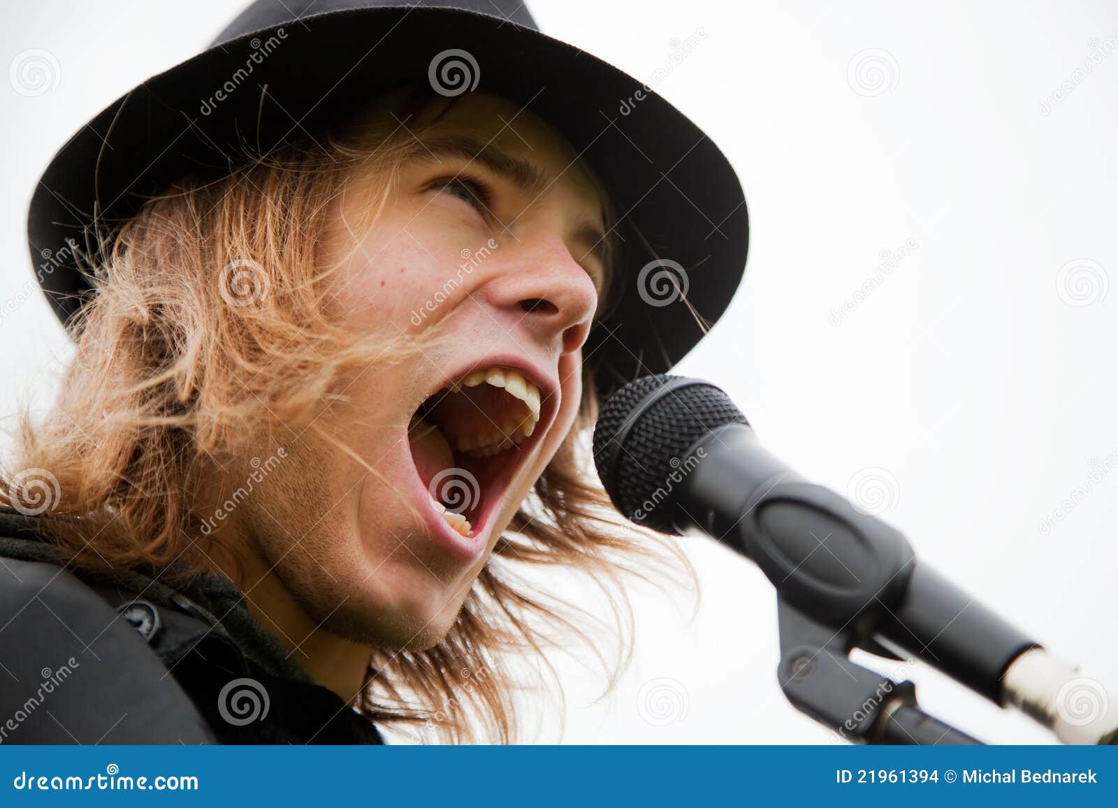 Young Man Sings To Microphone Stock Photo - Image of party, fashionable ...