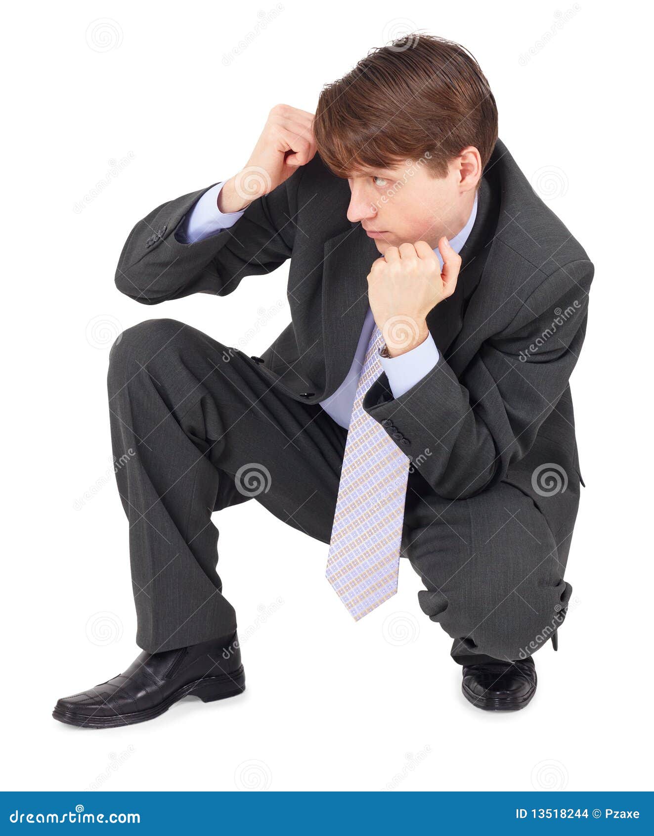 Young Man Sits in a Defensive Pose on White Stock Photo - Image of ...