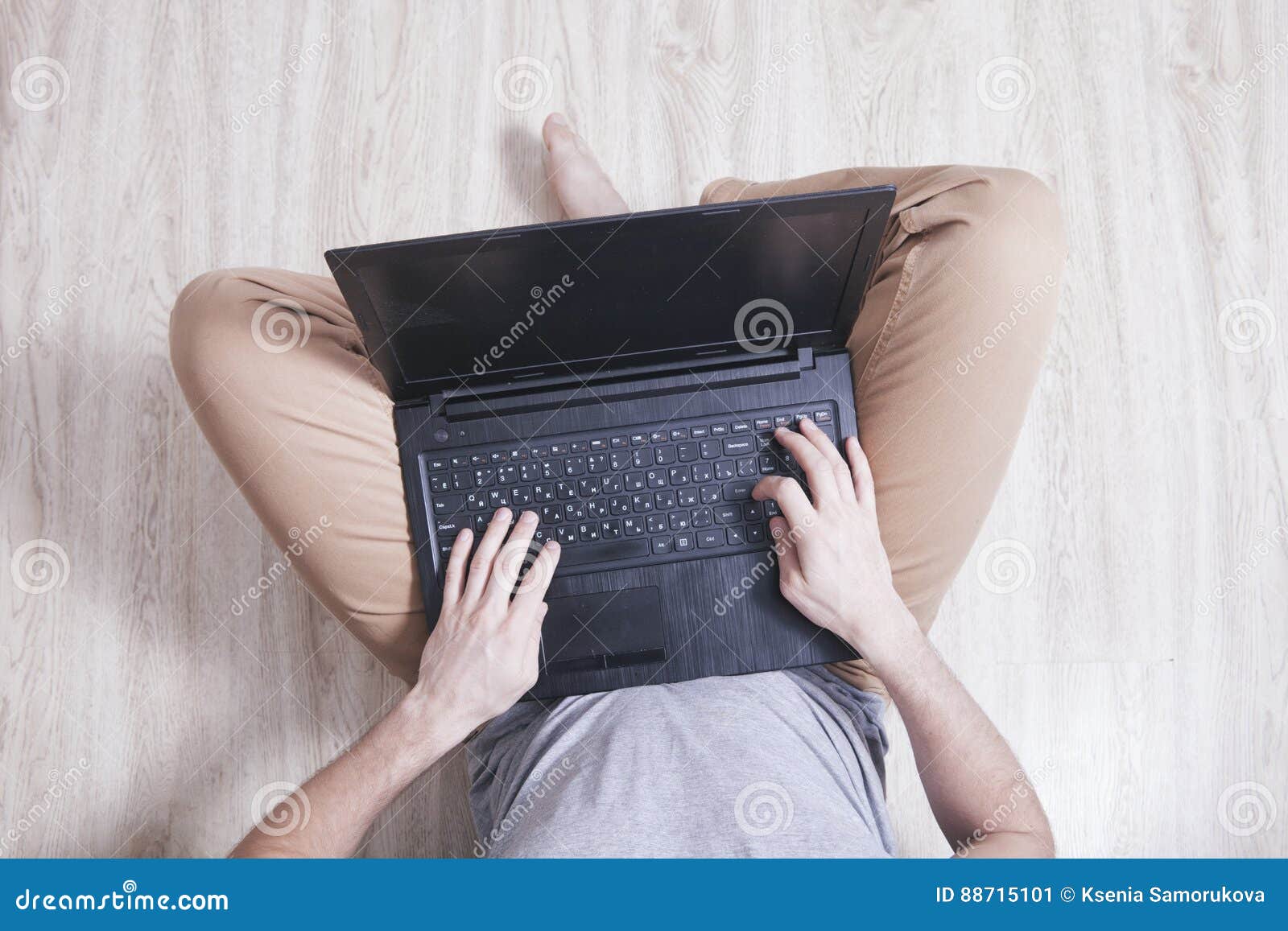 Young Man Sits on the Floor with Black Laptop Stock Image - Image of ...