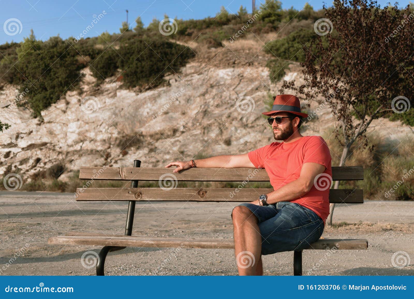 Young Man Sitting on the Beach Stock Photo - Image of caucasian, person ...