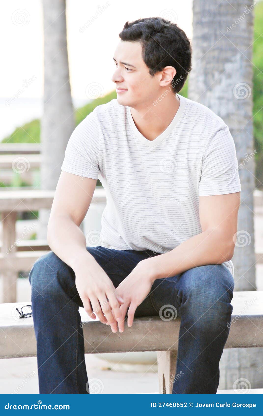 Young Man Sitting on a Bench Stock Photo - Image of nature, young: 27460652