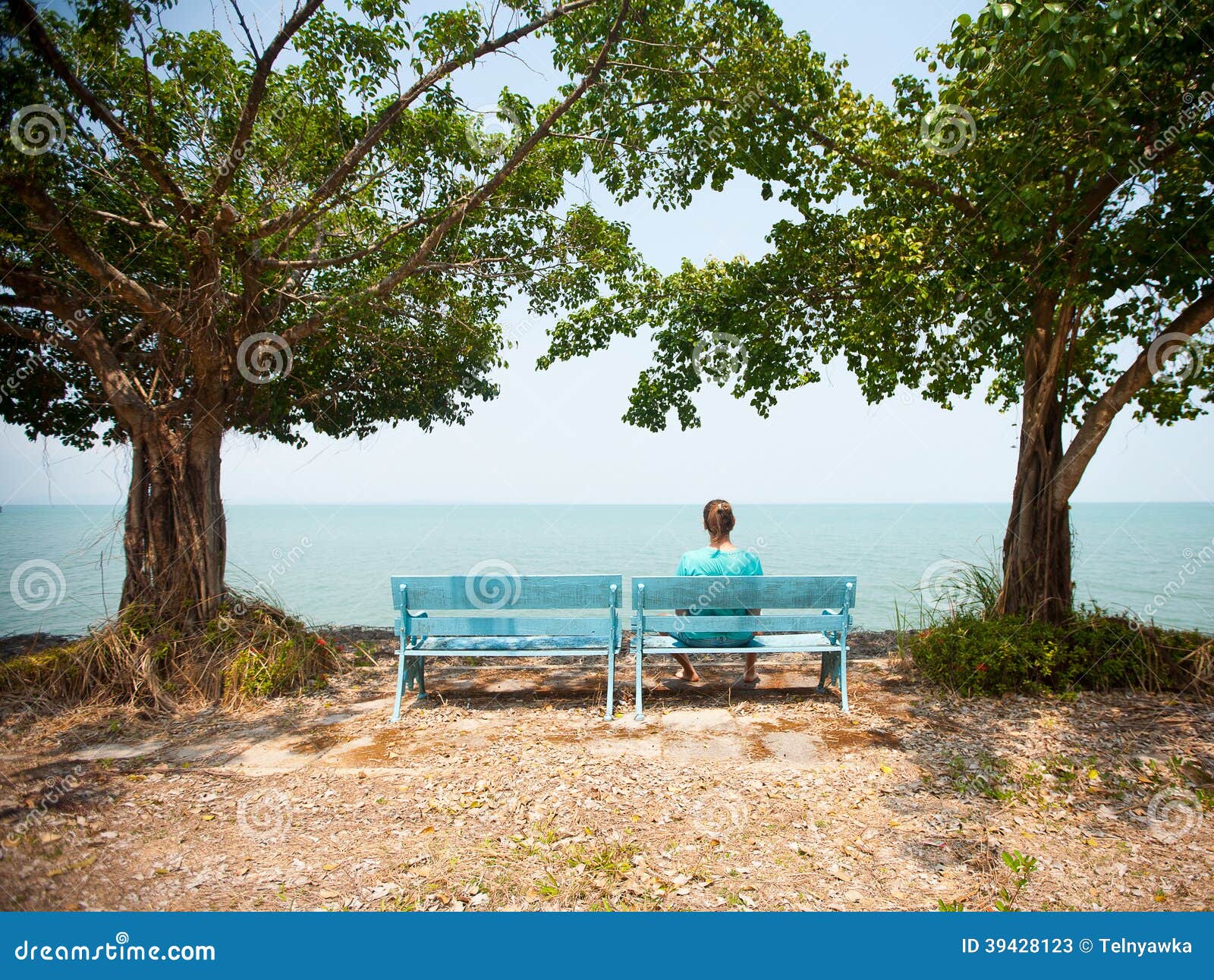 Young Man Sitting on Bench Facing the Sea Stock Image - Image of ...