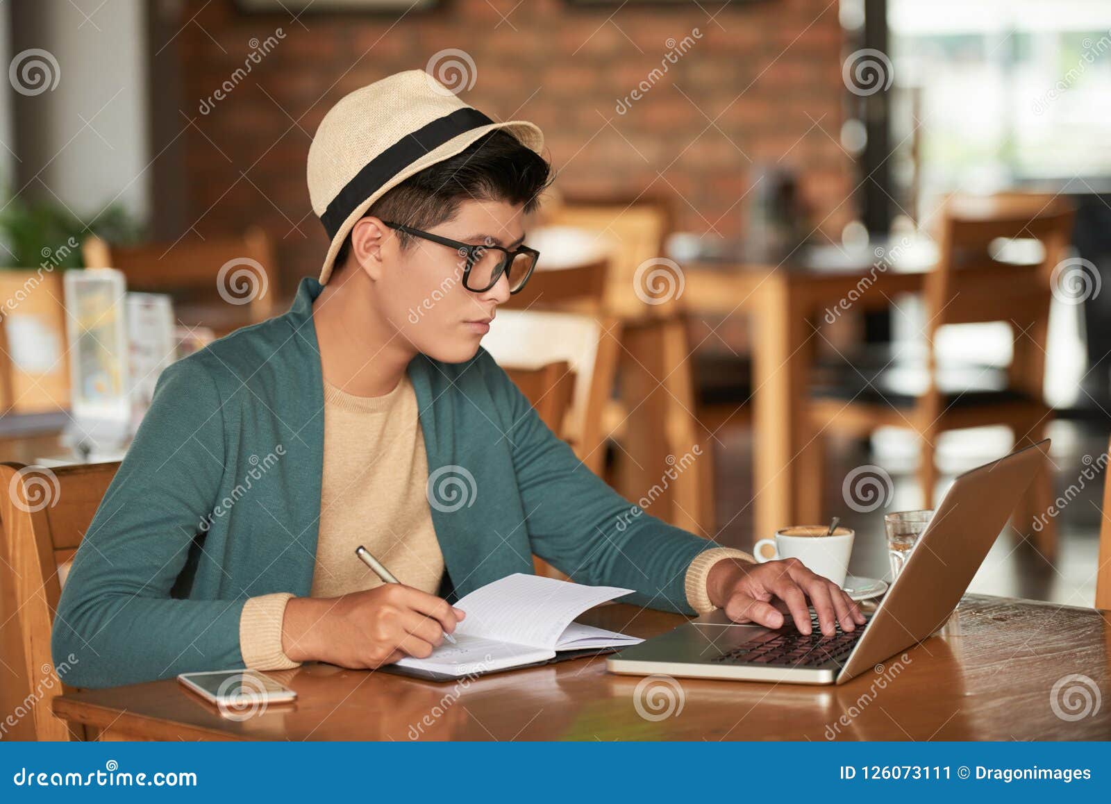 Man studying in cafe stock image. Image of searching - 126073111