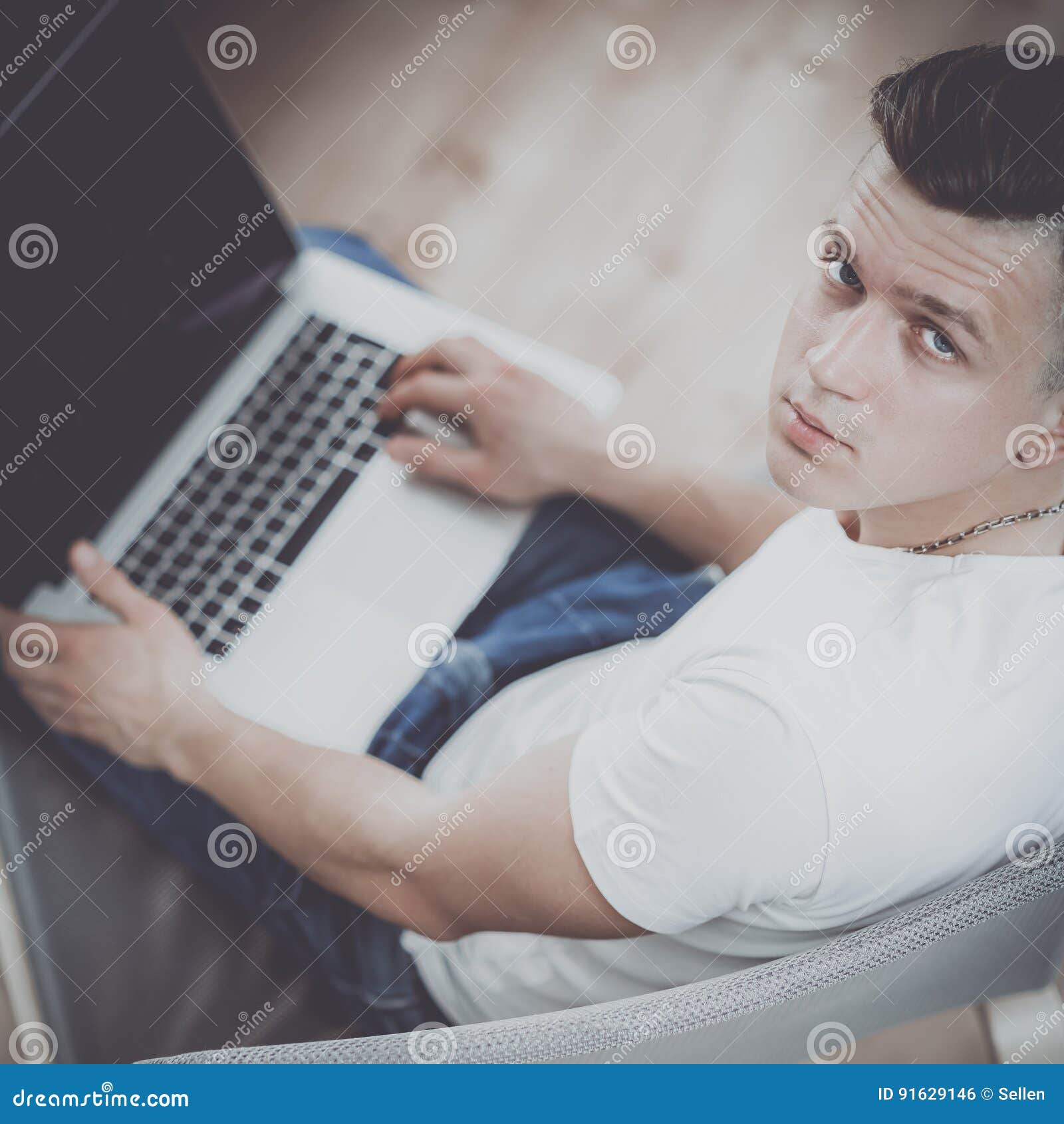 Young Man Sitting on Chair with Laptop Stock Photo - Image of adult ...