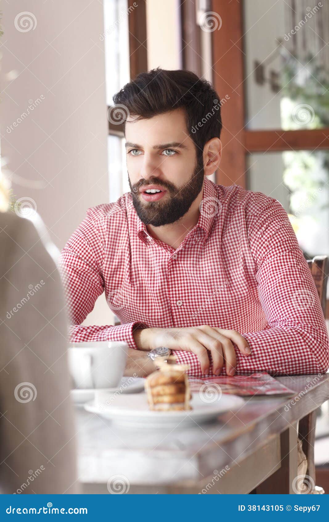 Young Man Sitting in Coffee Shop Stock Image - Image of drink, leisure ...