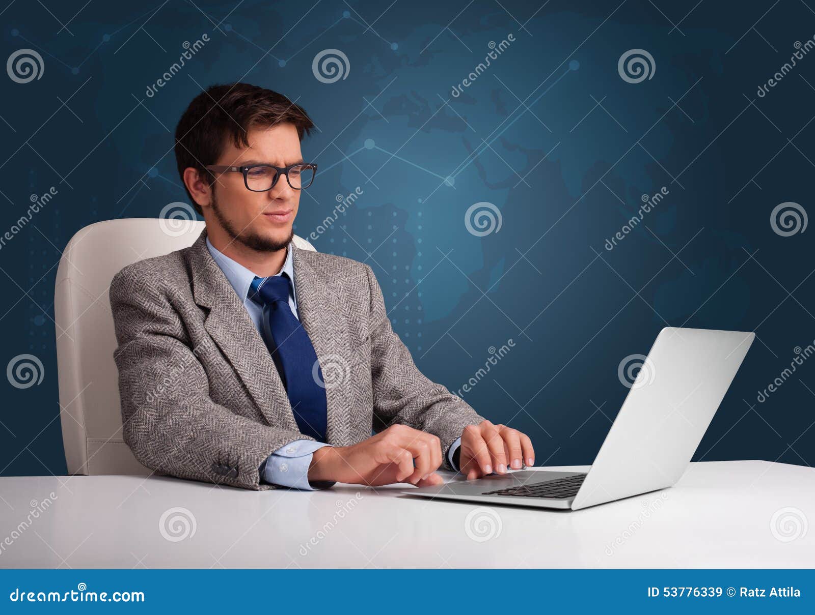 Young Man Sitting at Desk and Typing on Laptop Stock Image - Image of ...