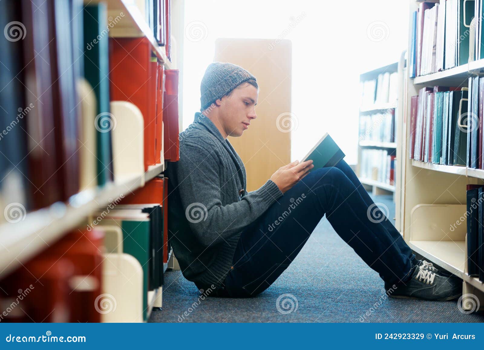 Getting His Study Material for the Year. a Young Man Sitting on the ...