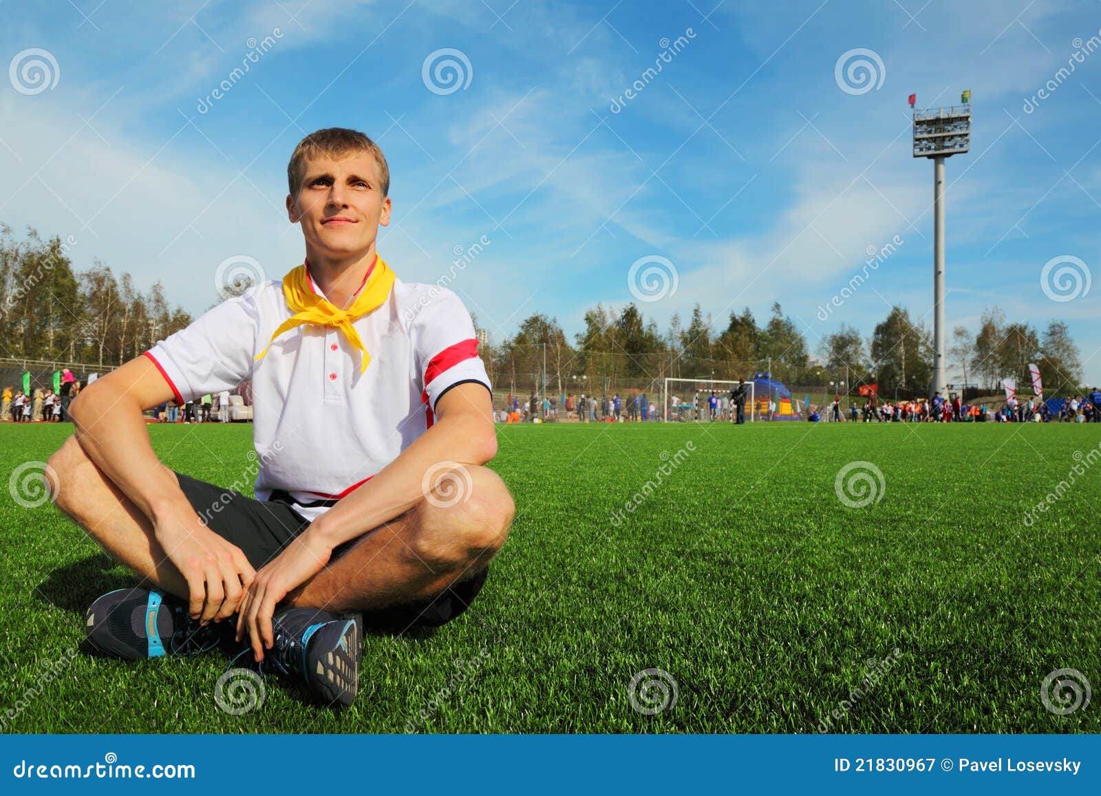 Young Man Sitting on Football Field Stock Image - Image of foot, play ...