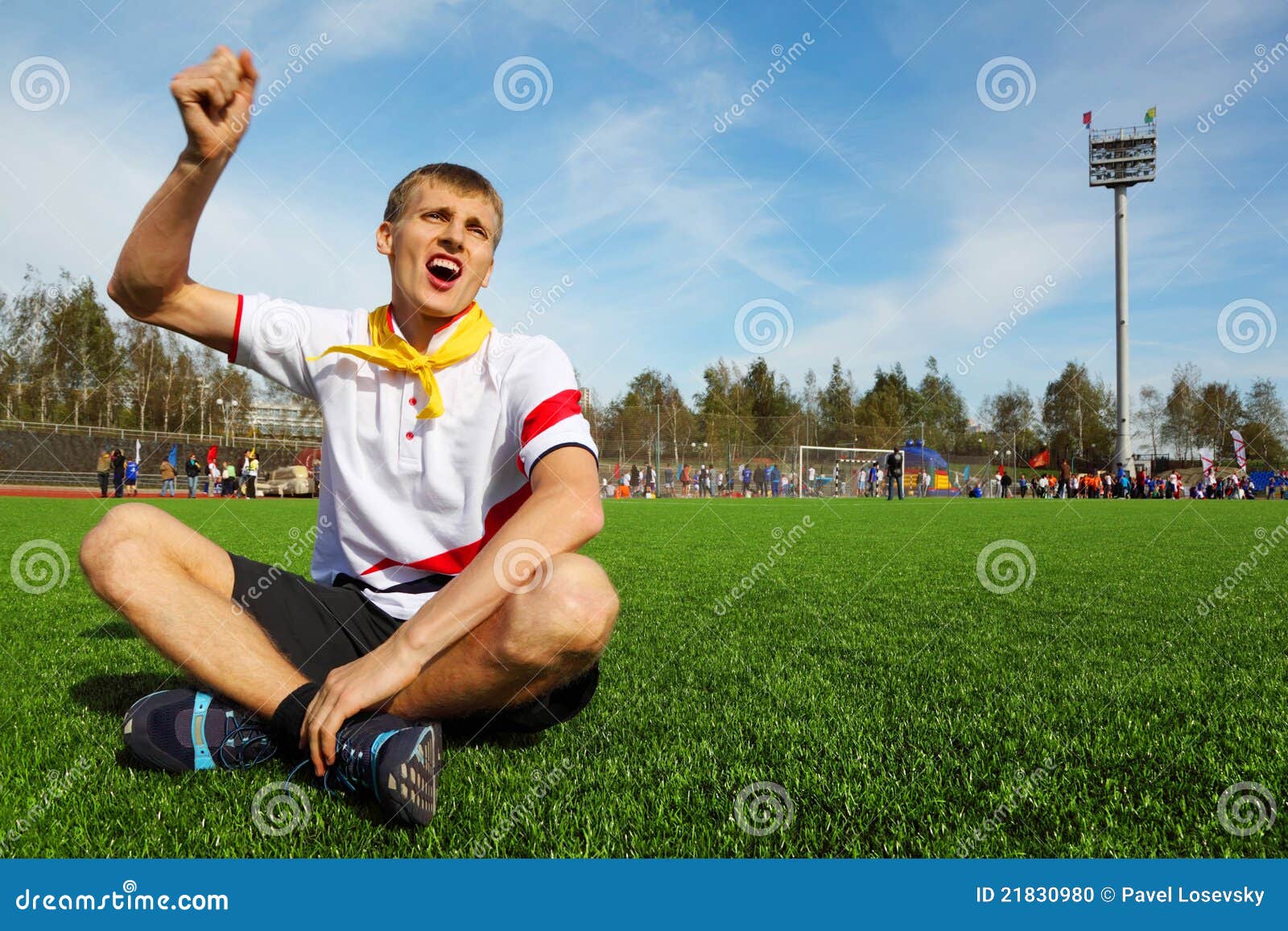 Young Man Sitting on Football Field and Shouting Stock Photo - Image of ...