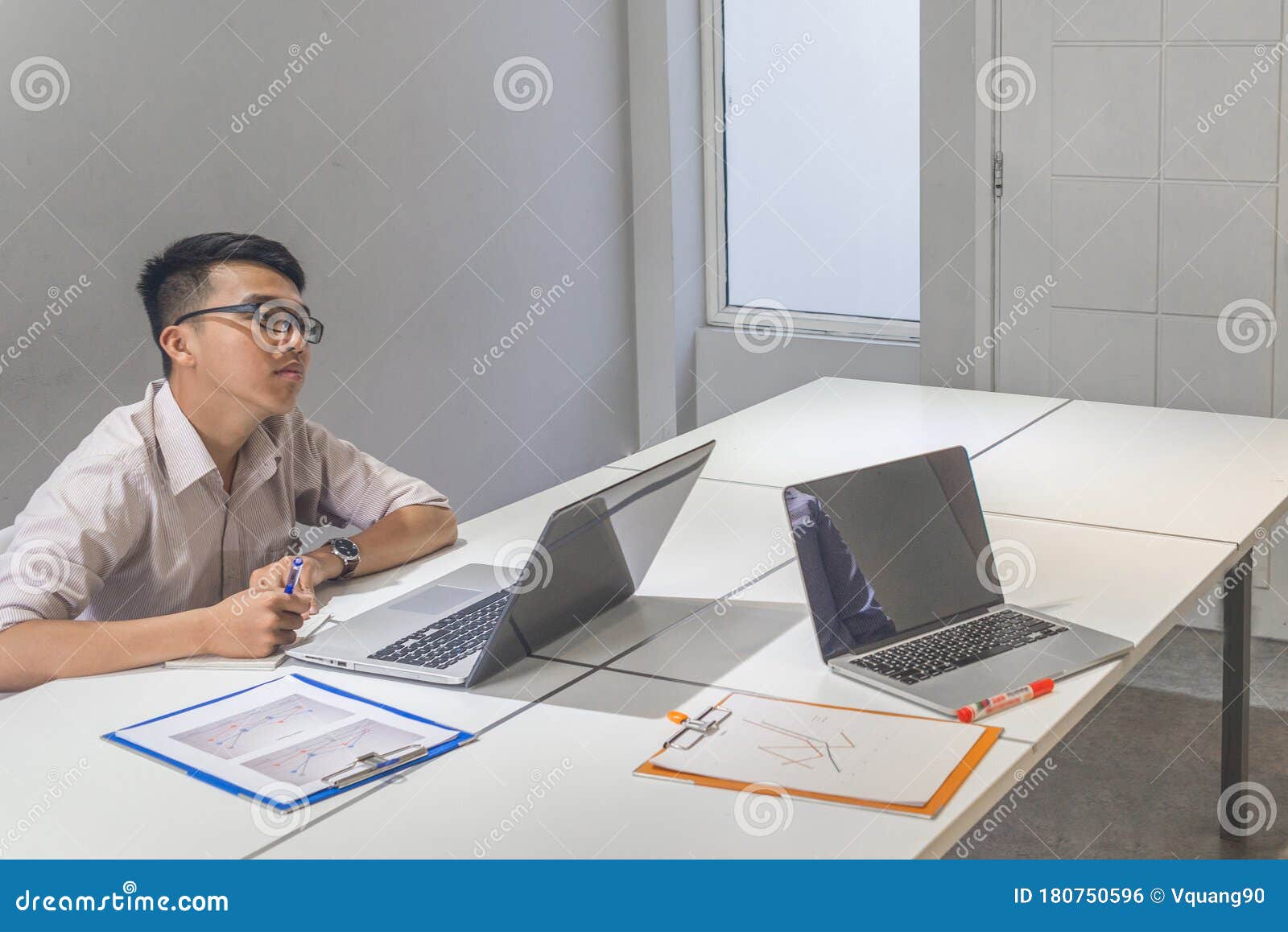 Young Man Sitting in Front of Laptop and Thinking Stock Photo - Image ...