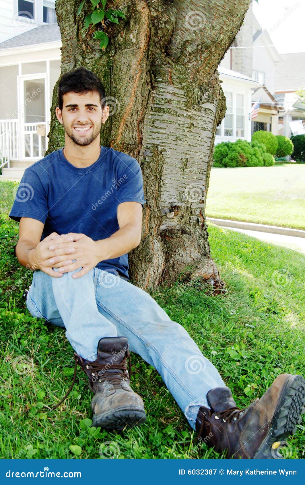 Young Man Sitting in Front Yard Stock Image - Image of single ...