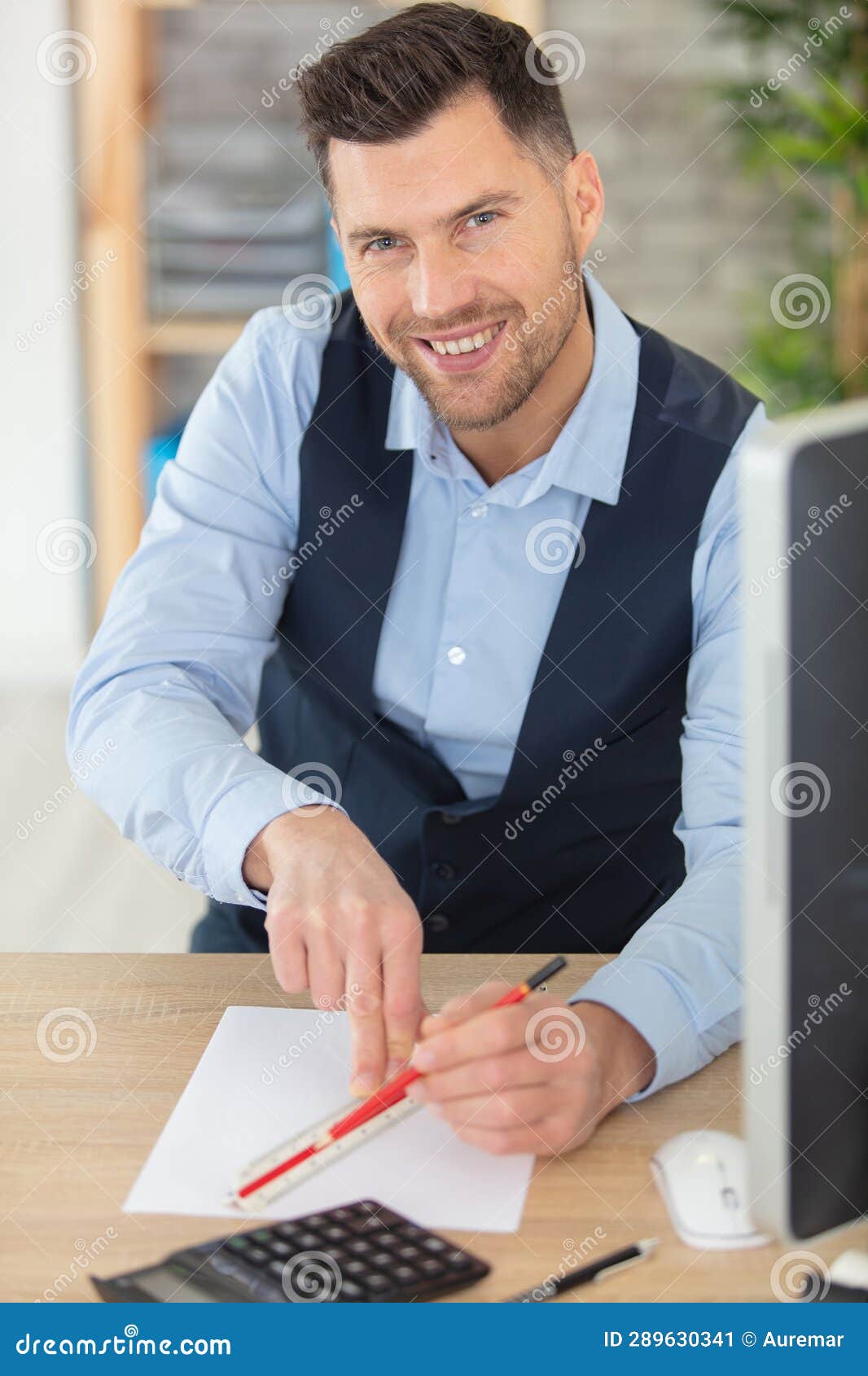 Young Man Sitting at Desk in Office Stock Image - Image of worker ...