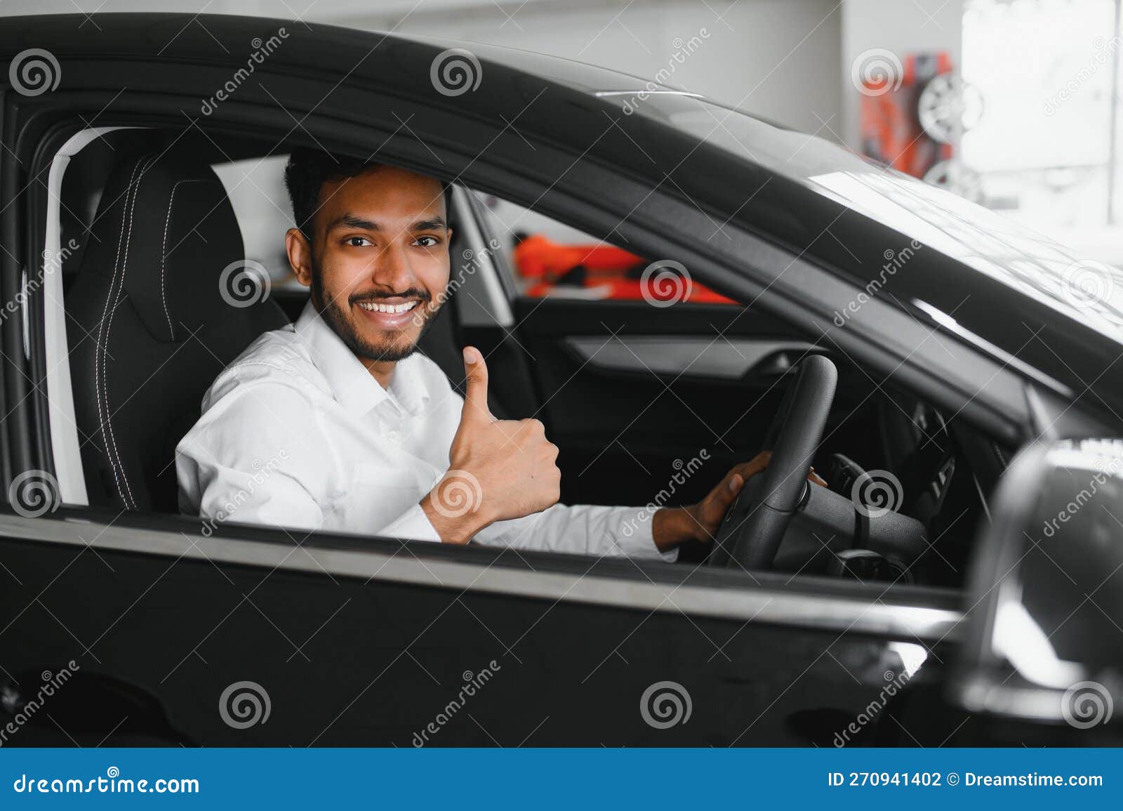 Young Man Sitting Inside New Car. Smiling Stock Photo - Image of 2025 ...