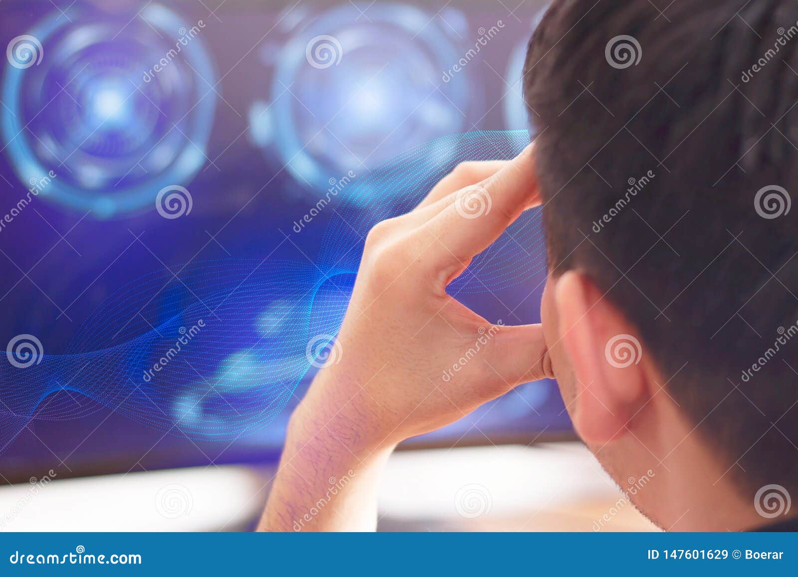 A Young Man Sitting at Office Computer Screen with Futuristic Sci Fi it ...