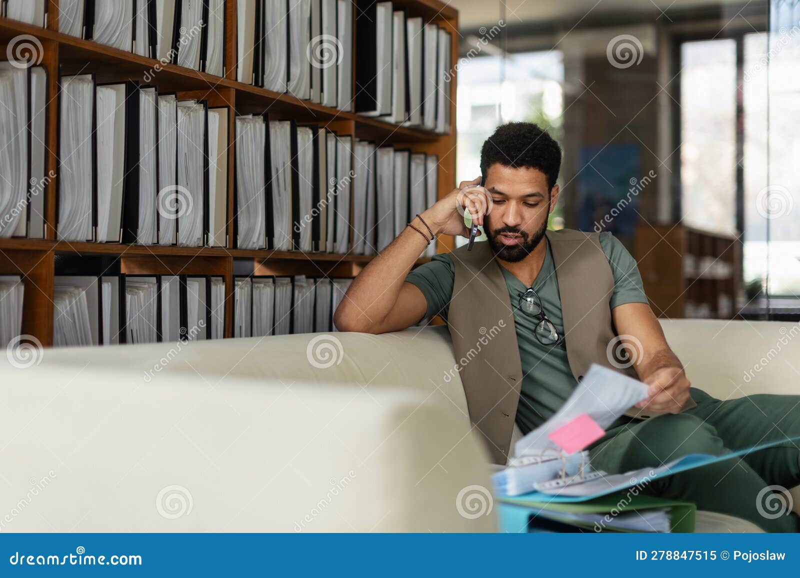 Young Man Sitting in Office and Working. Stock Image - Image of room ...