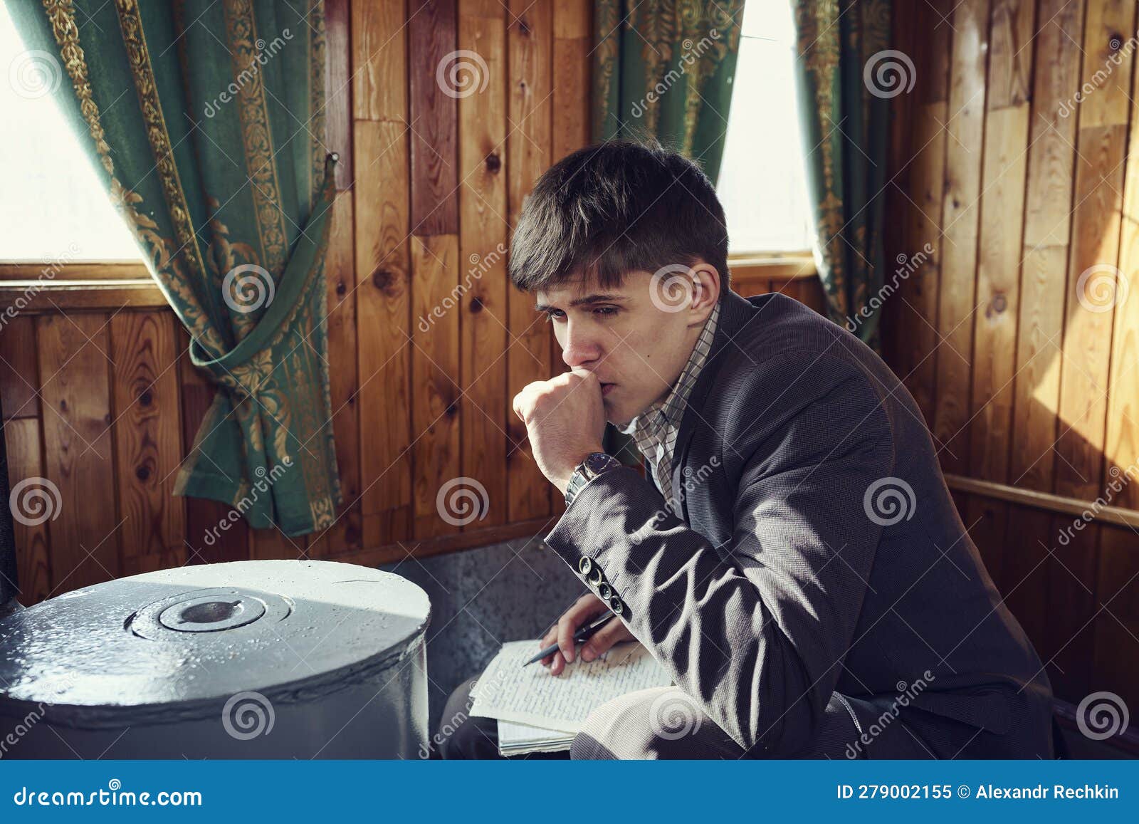 Young Man is Sitting in an Old Rare Railway Car Writing Notes Warming ...