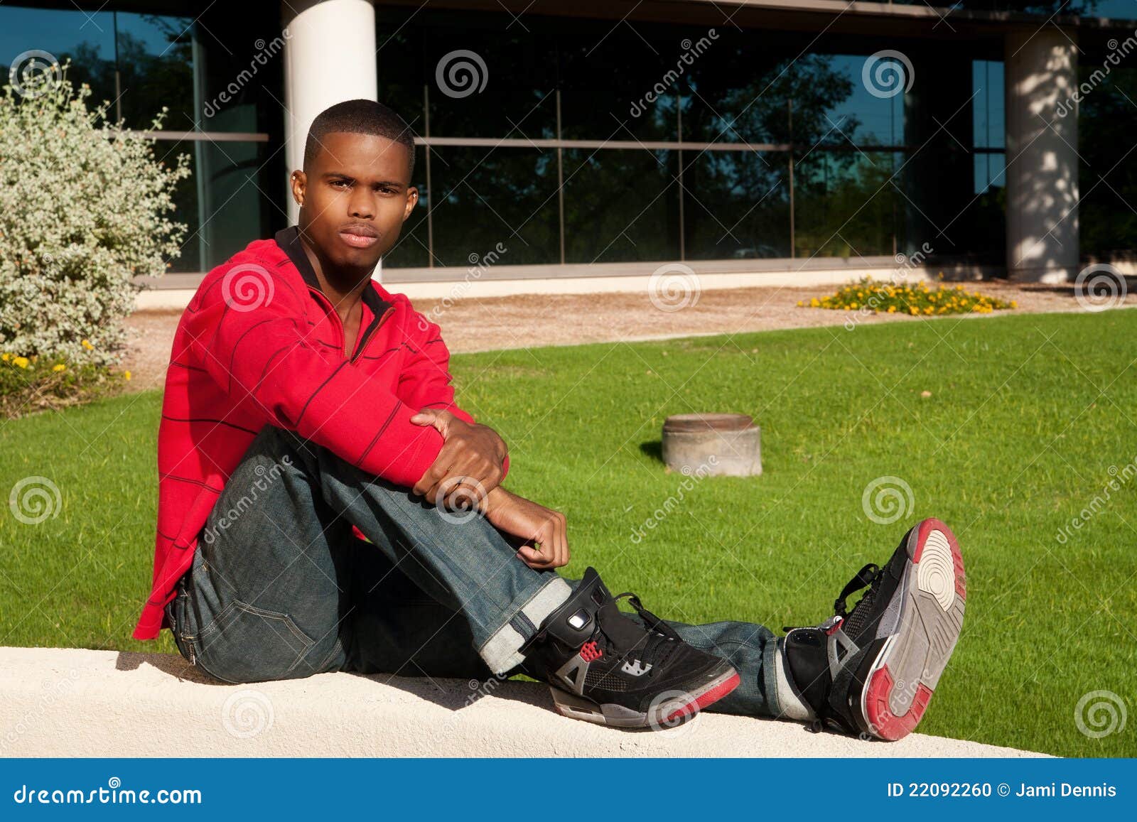 Young Man sitting outdoors stock photo. Image of outdoors - 22092260