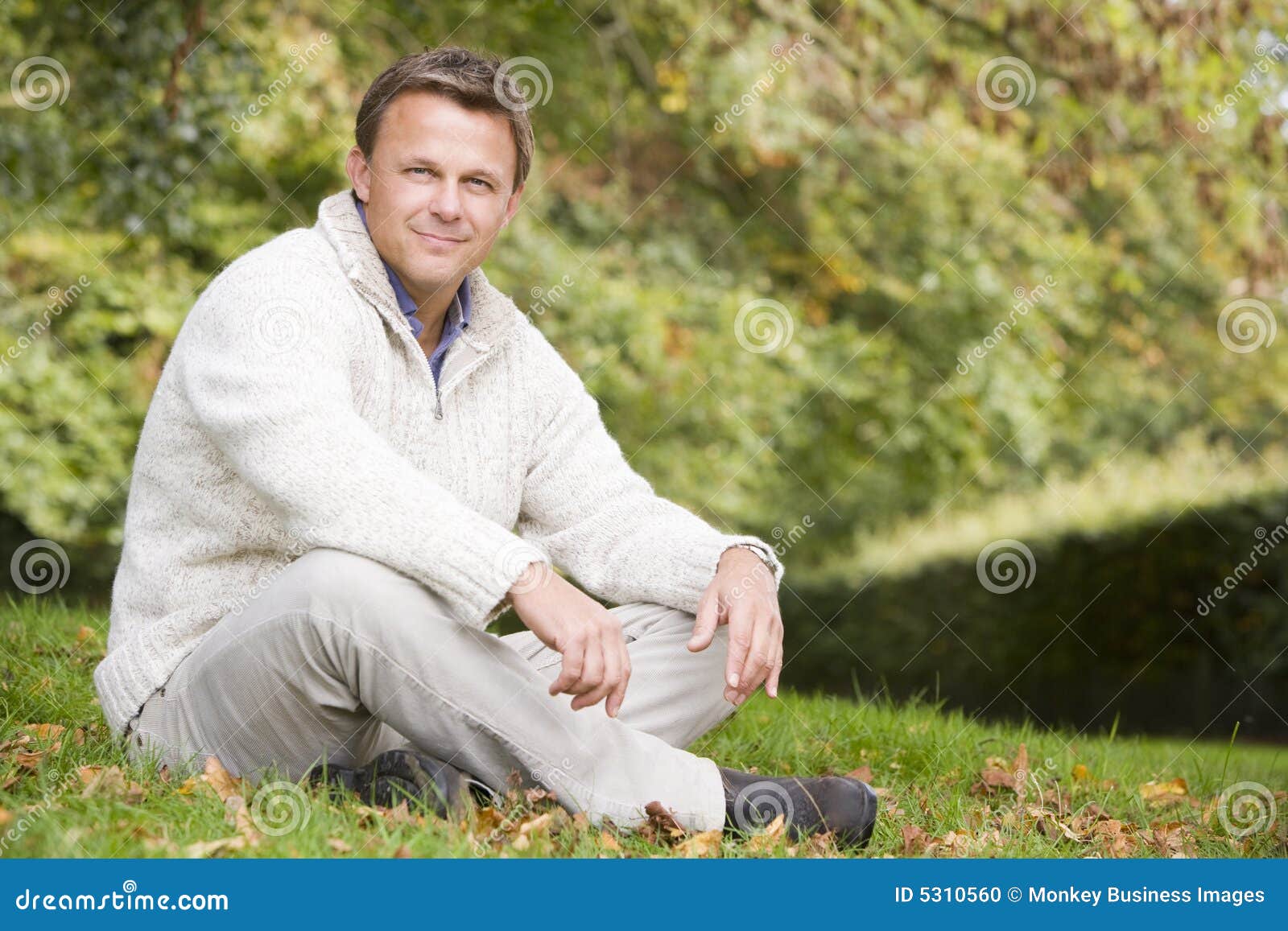 Young Man Sitting Outside in Autumn Landscape Stock Photo - Image of ...