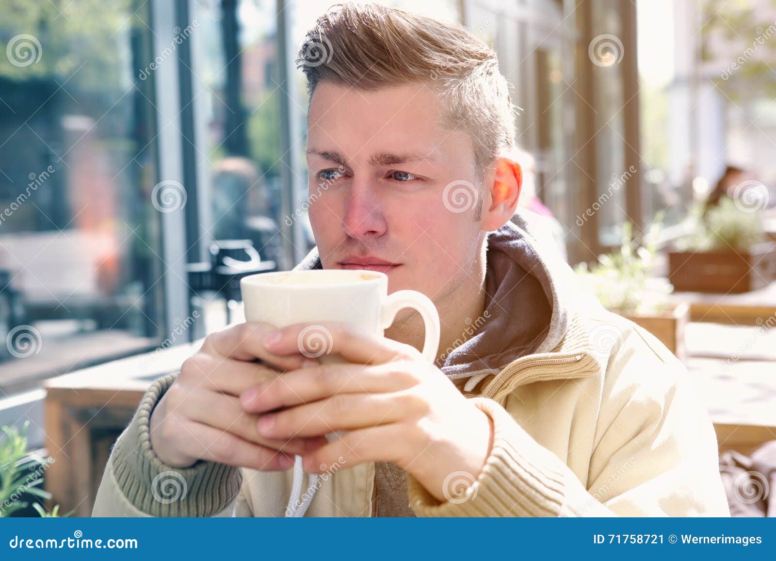 Young Man Sitting Outside and Drinking Coffee Stock Image - Image of ...
