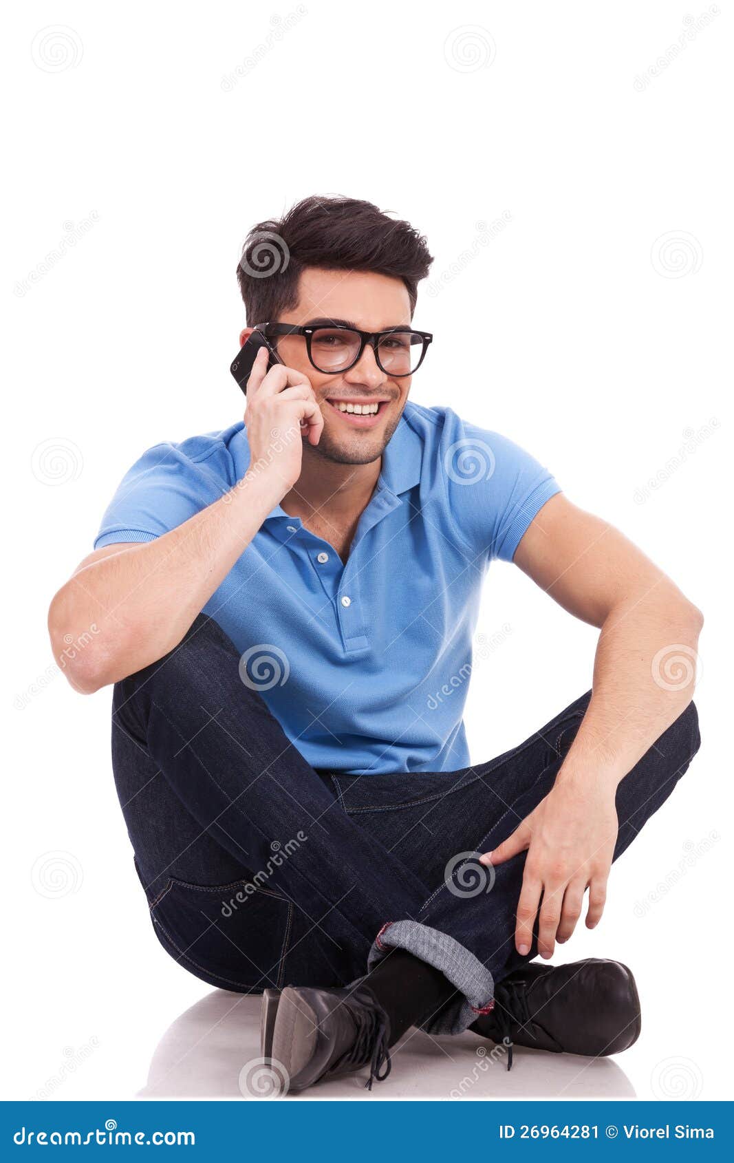 Young Man Sitting while on the Phone Stock Image - Image of groomed ...
