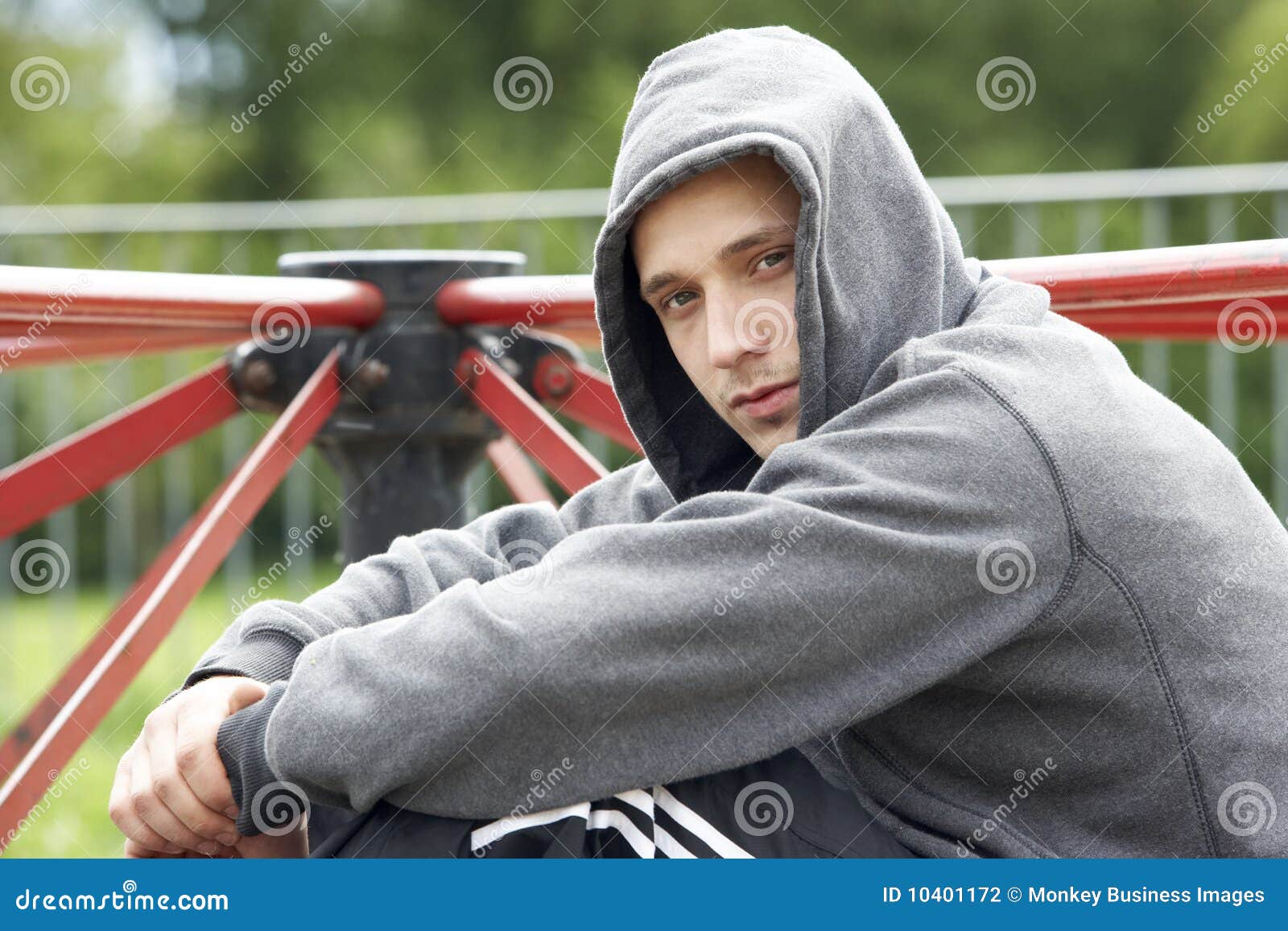 Young Man Sitting in Playground Stock Photo - Image of nineteen ...
