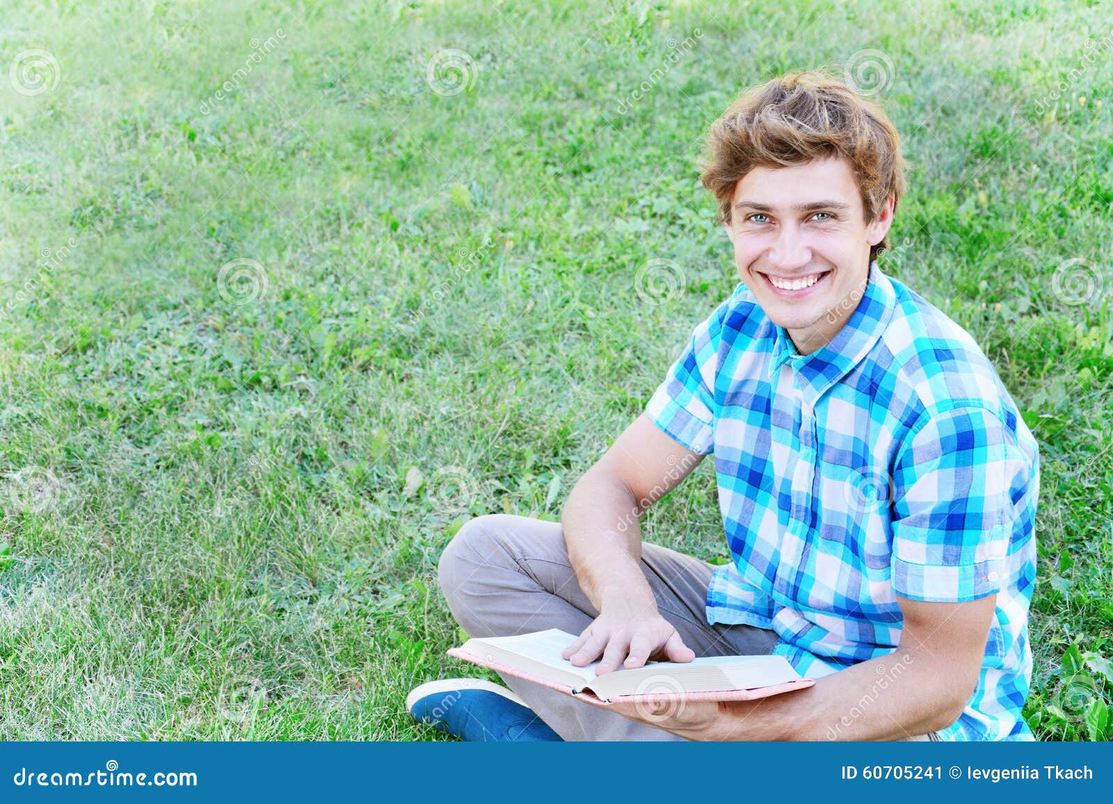 Young Man is Sitting and Reading a Book Stock Image - Image of people ...