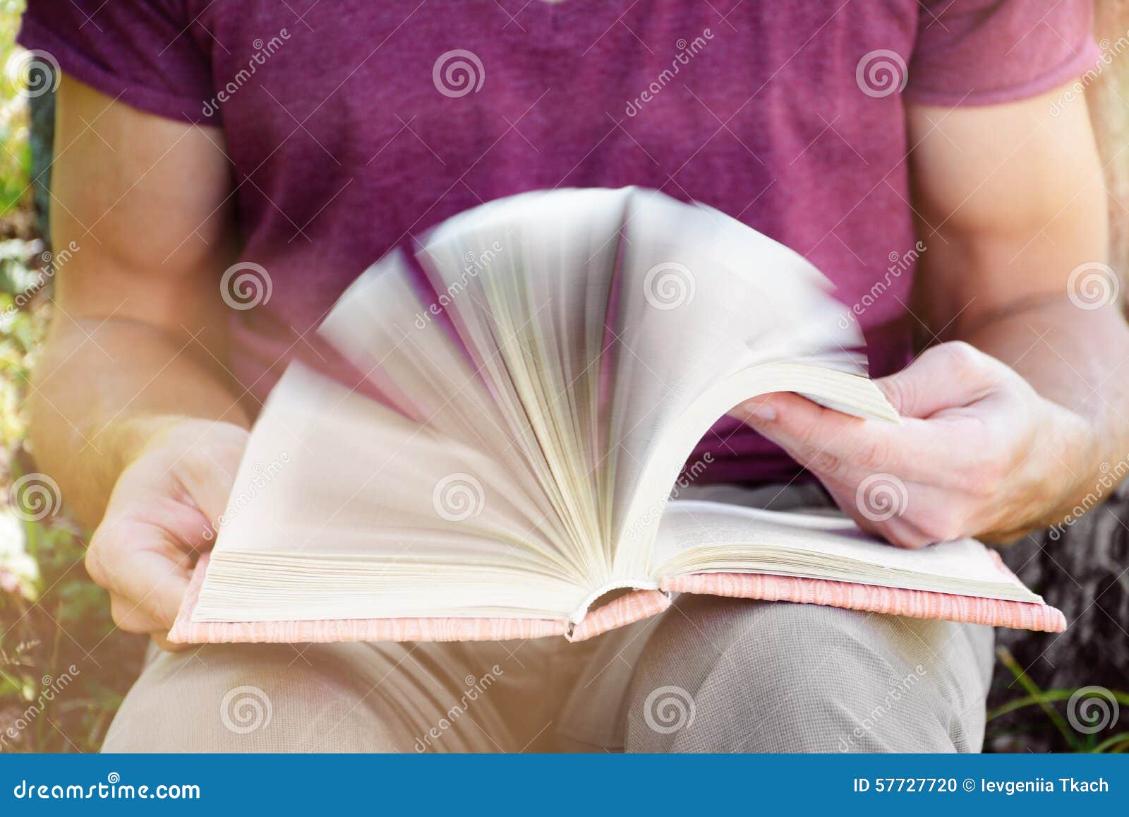 Young Man is Sitting and Reading a Book Stock Photo - Image of serious ...