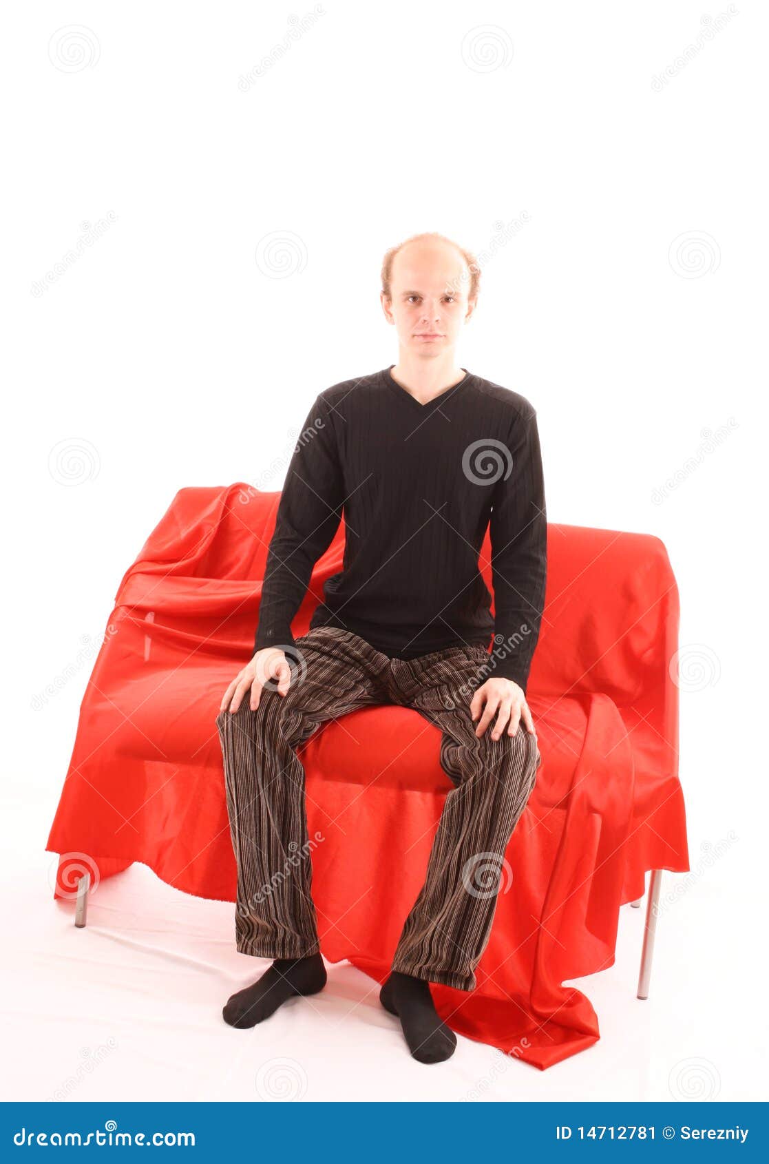 Young Man Sitting on Red Sofa Isolated Stock Image - Image of isolated ...