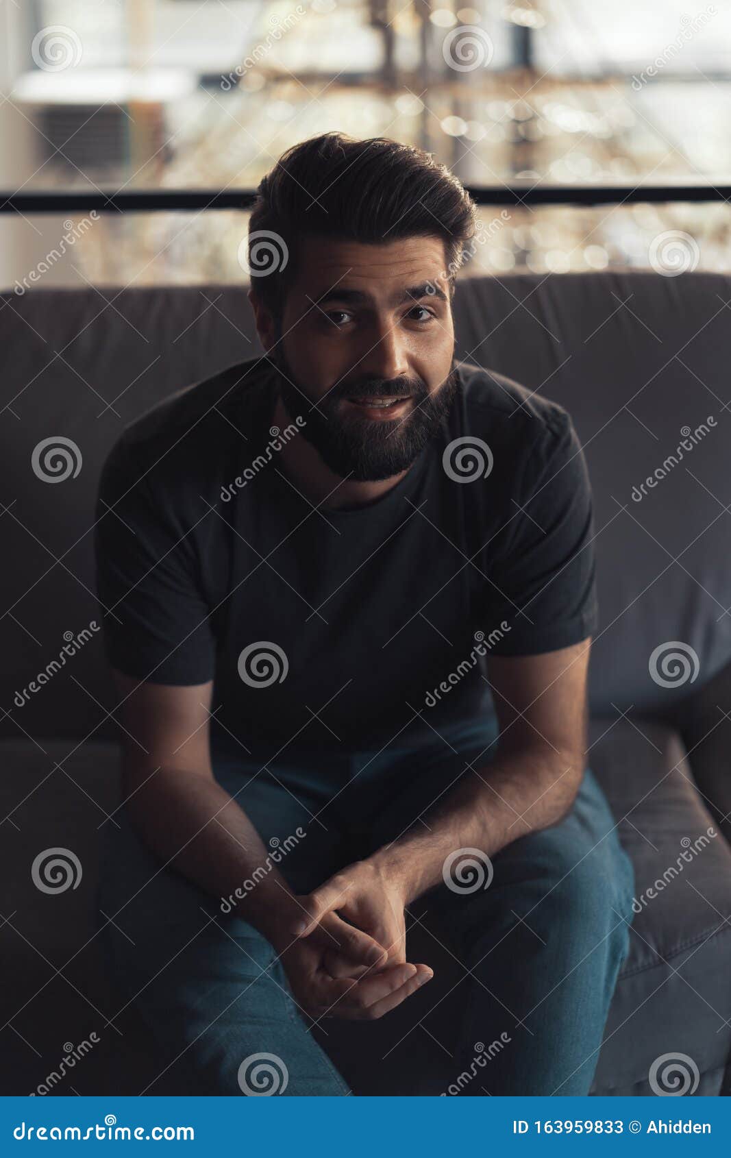 Young Man Sitting Relaxing on the Couch Stock Image - Image of language ...
