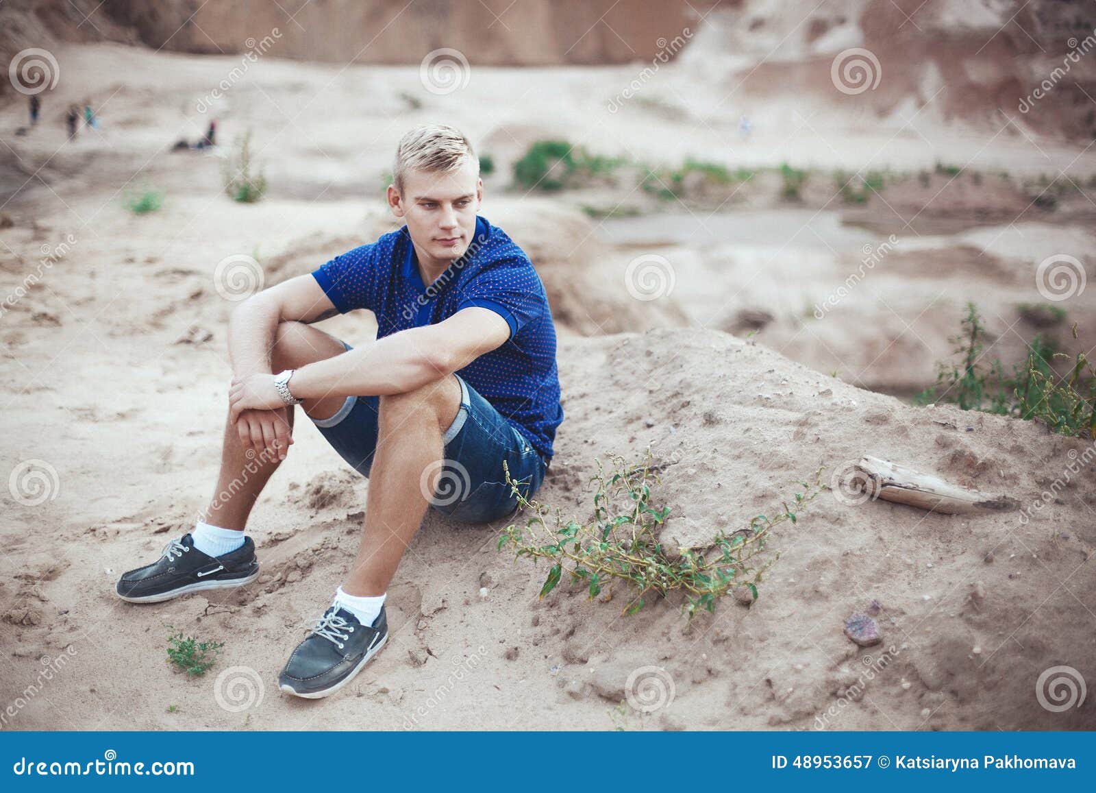 Young Man Sitting on the Sand Alone Stock Image - Image of summer ...