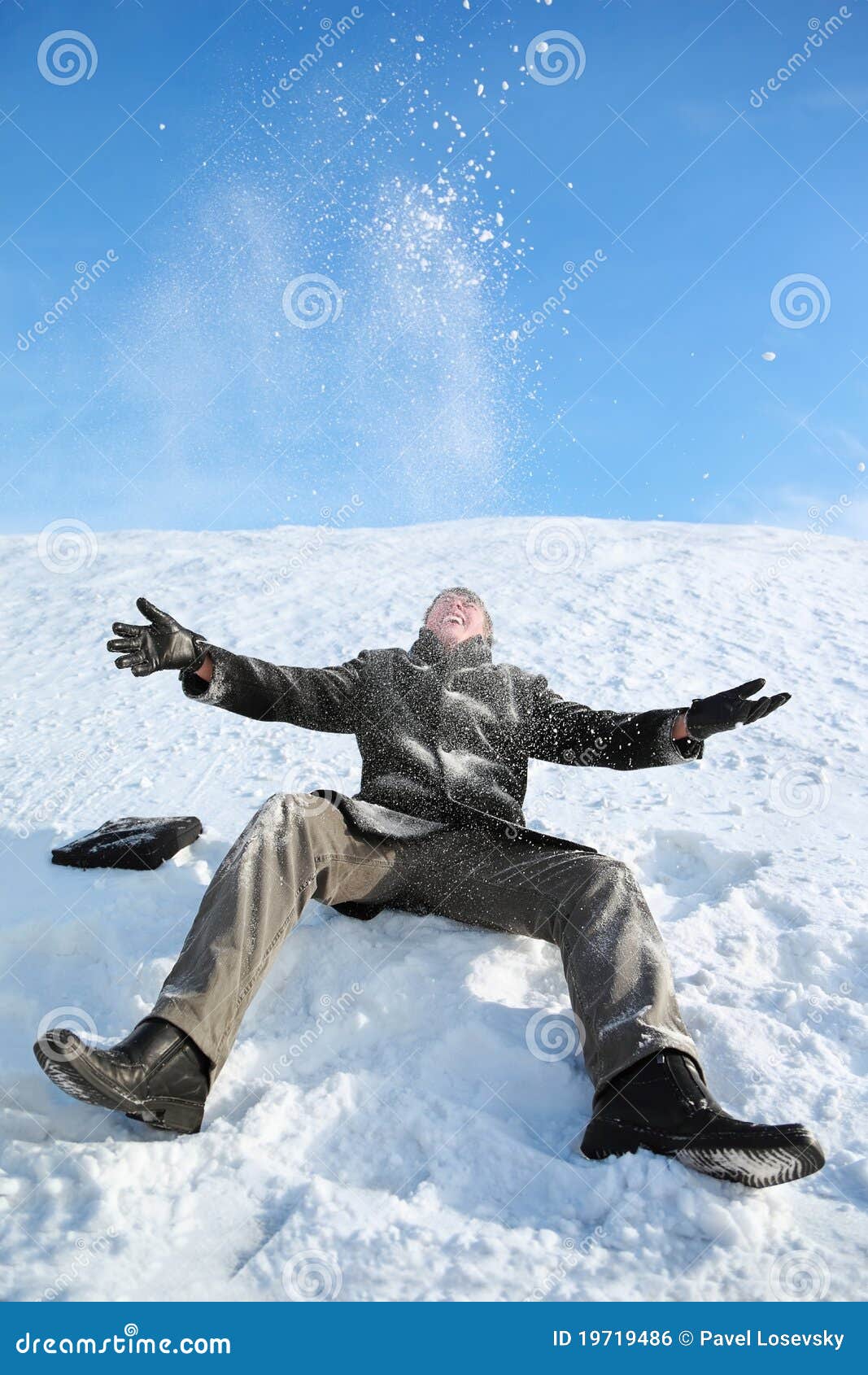 Young Man Sitting on Snow and Throw Him Upwards Stock Photo - Image of ...