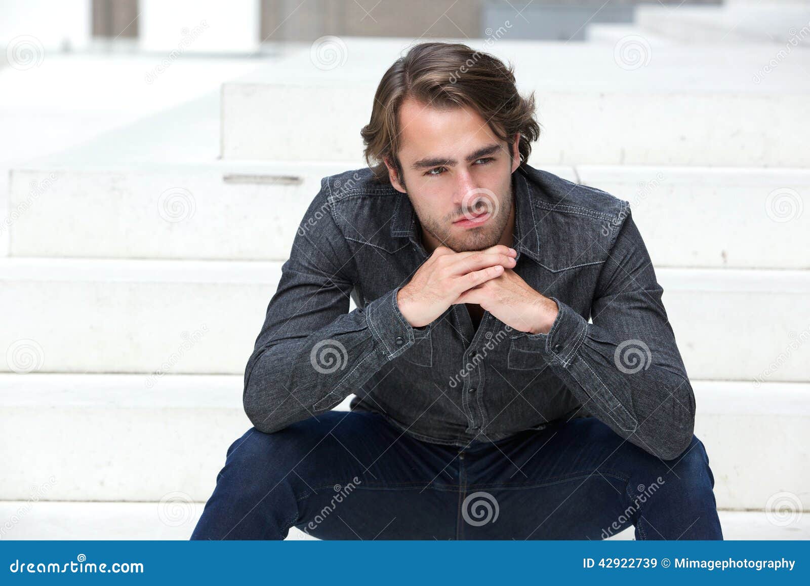Young Man Sitting on Steps Outside Stock Image - Image of handsome ...