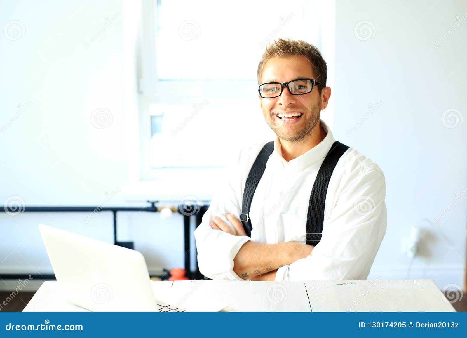 Young Man Sitting at the Table Stock Image - Image of employee, modern ... Young Man Sitting at the Table Stock Image - Image of employee, modern ...