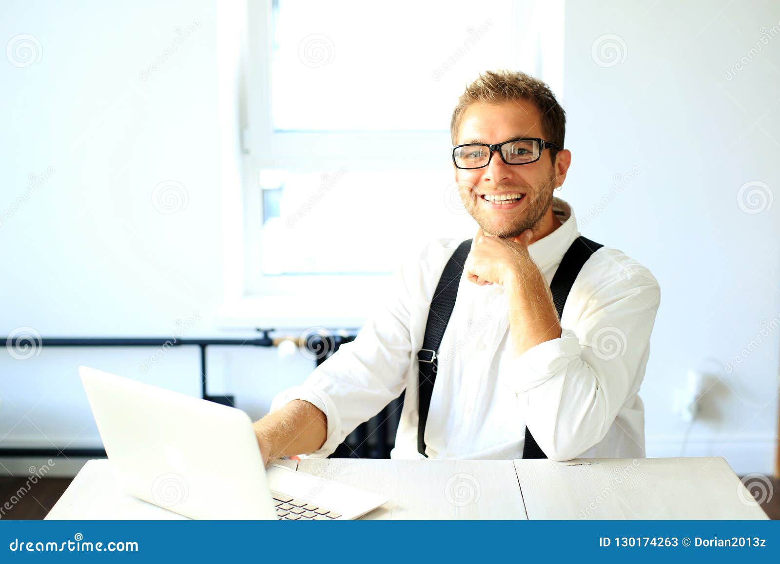 Young Man Sitting at the Table Stock Image - Image of glasses, hand ...