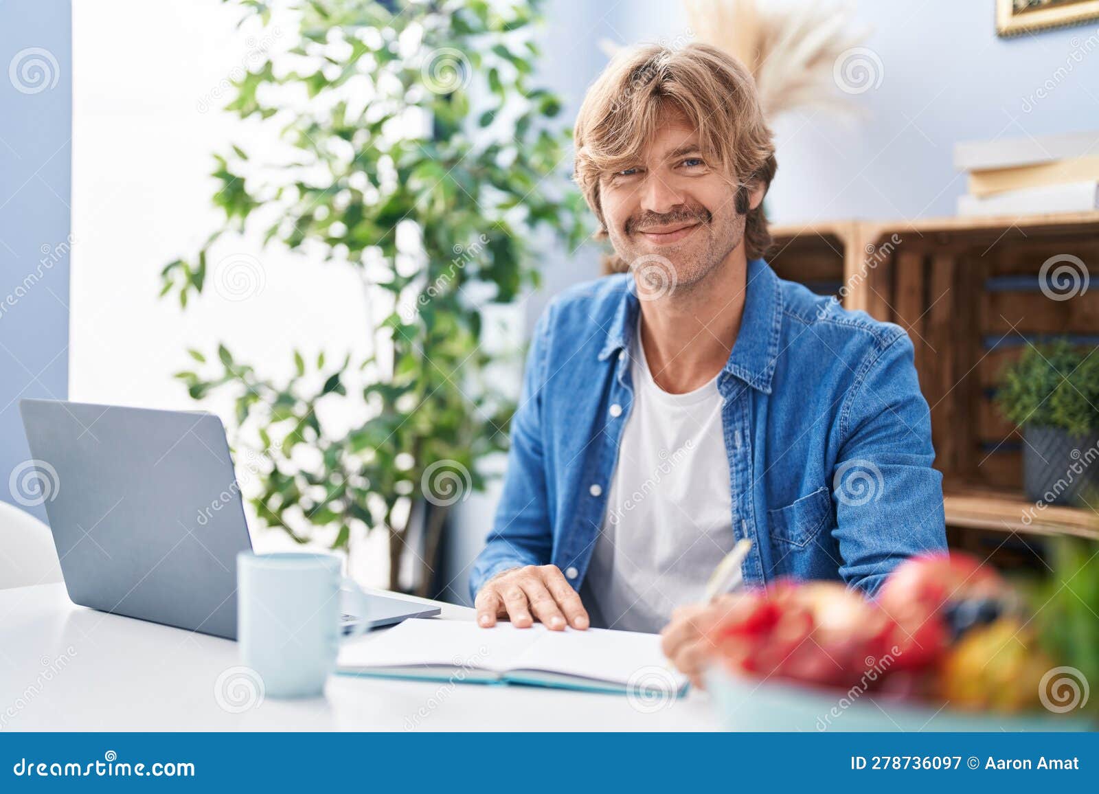 Young Man Sitting on Table Studying at Home Stock Image - Image of ...