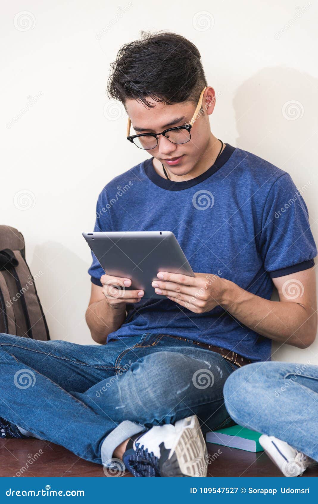 Young Man Sitting Useing with Technology Tablet Stock Image - Image of ...